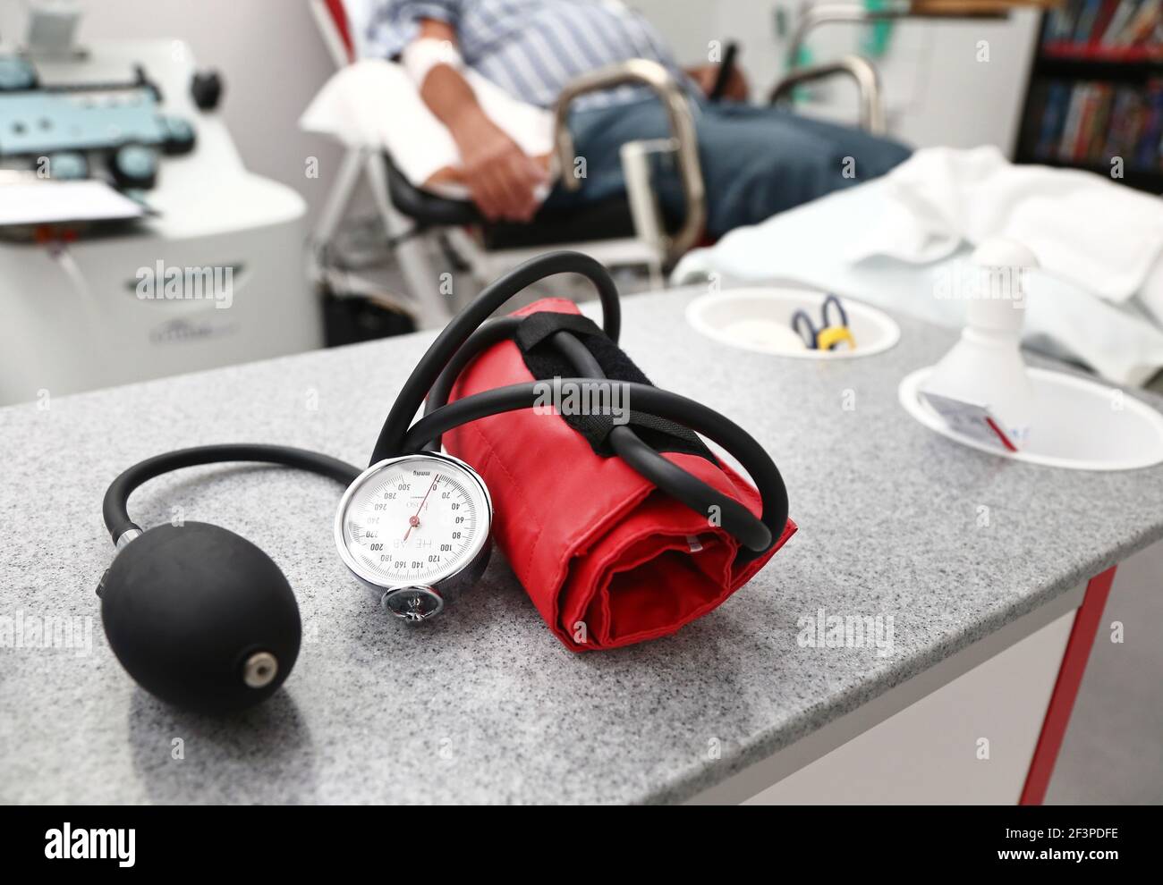 Blood pressure cuff and patient Stock Photo - Alamy