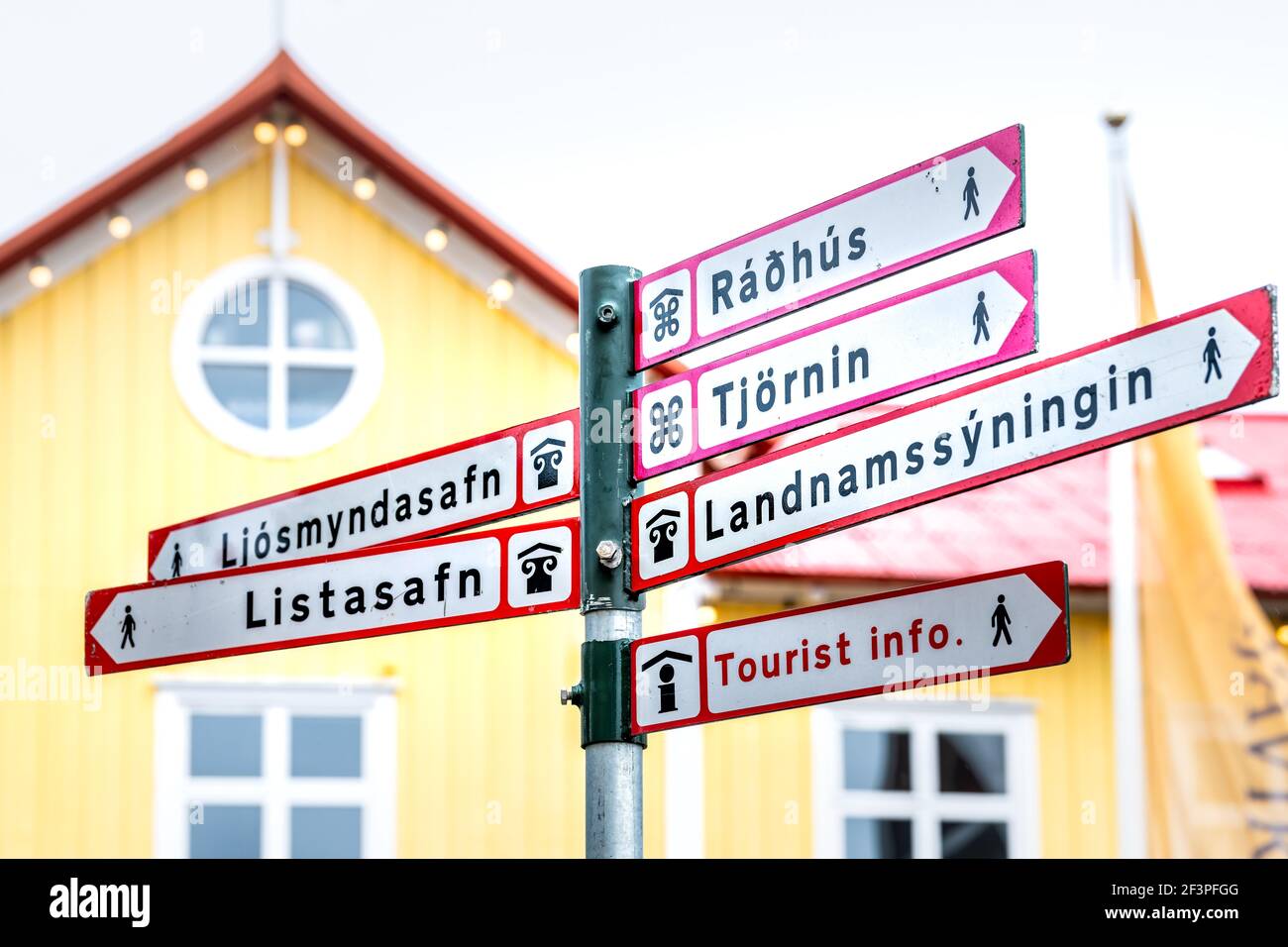 Reykjavik, Iceland street road in downtown center and sign by yellow ...