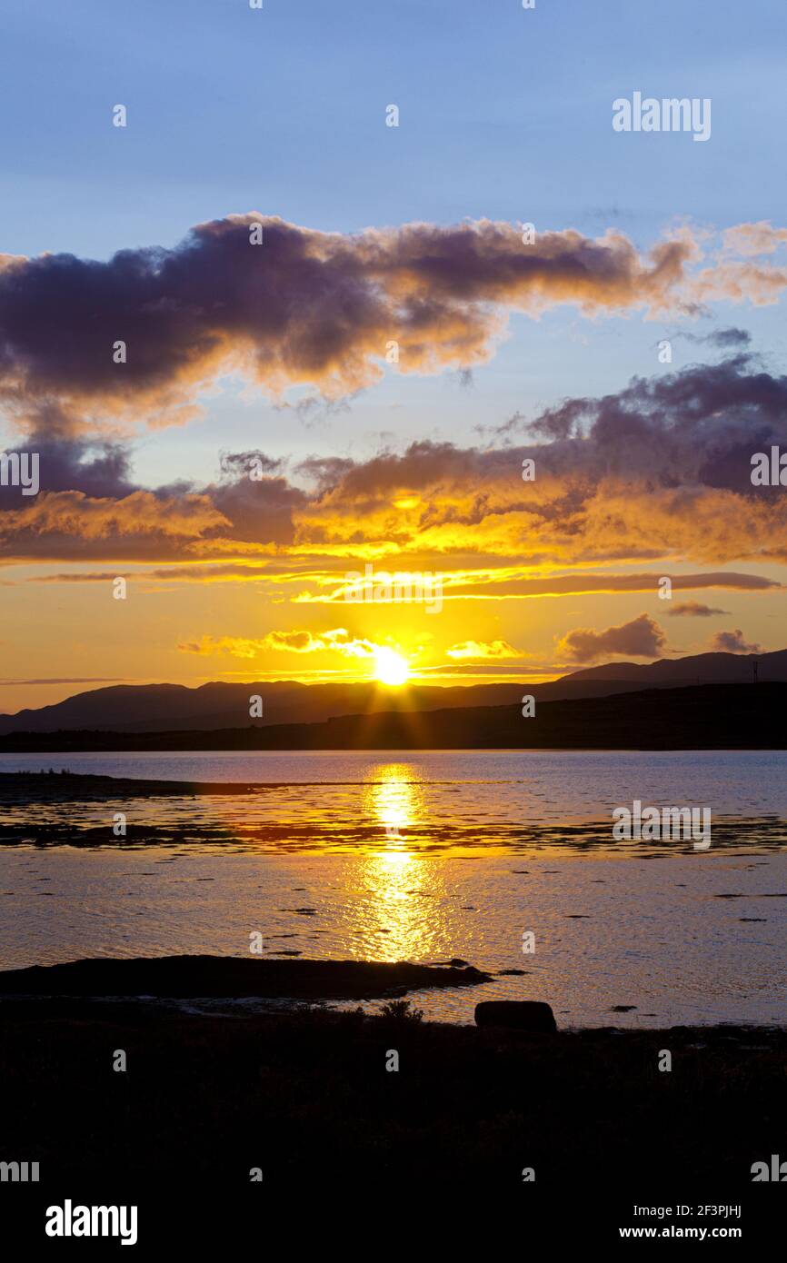 A sunset across Loch na Cille to the Keillmore Peninsula viewed from ...