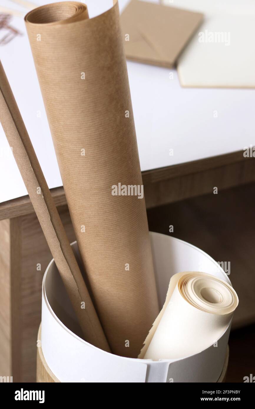 Creative Studio Space. Kraft Paper Rolls in Front of Office Desk with ...