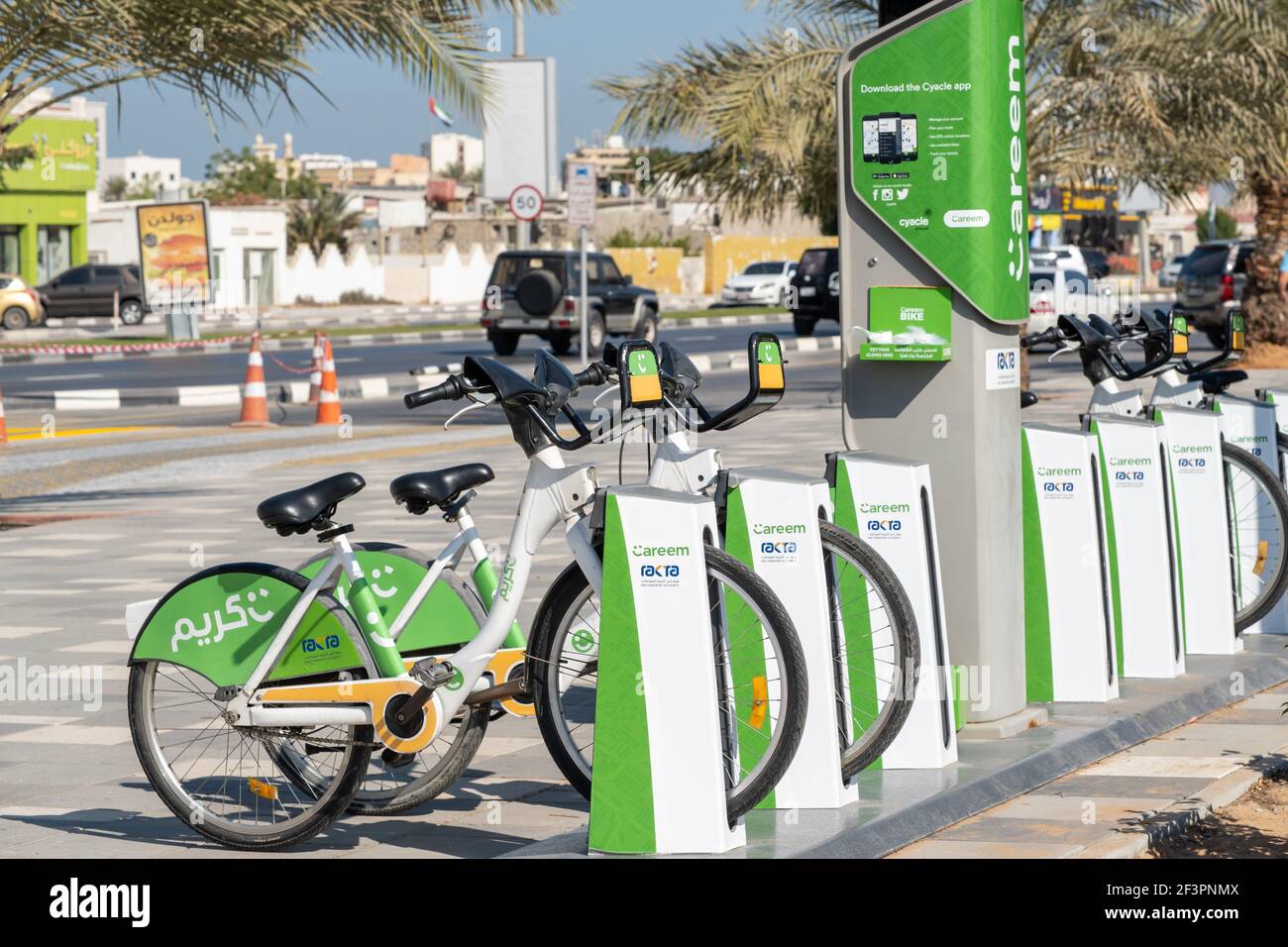 Ras al Khaimah United Arab Emirates 12.22.2020 Careem eco friendly green bike rentals in a row at the RAK Corniche for exercise and fun Stock Photo Alamy