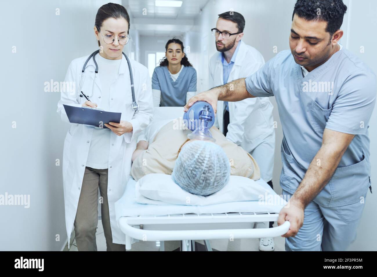 Medical team performing a reanimation with defibrillator to the patient ...