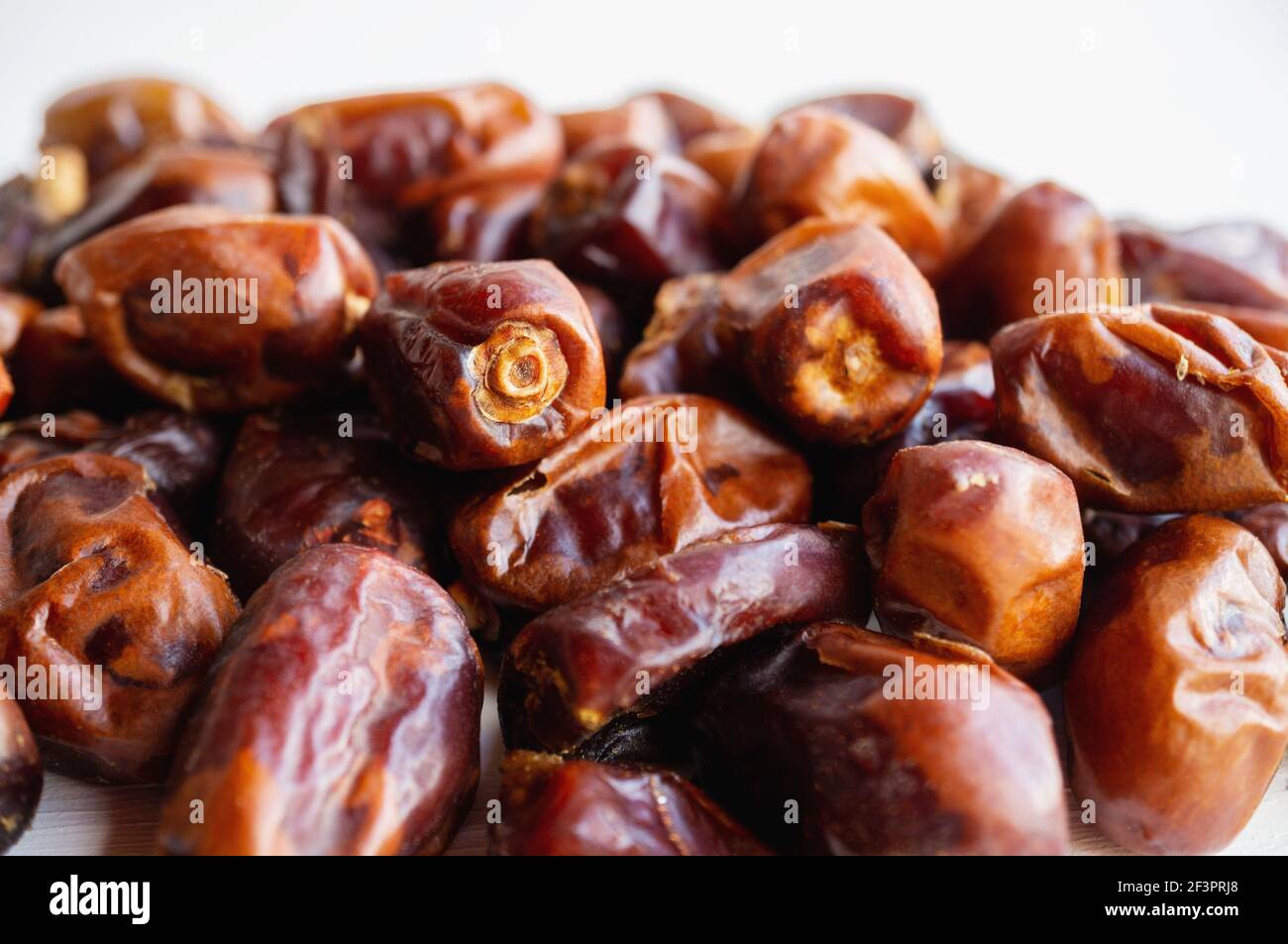 Dried dates, food background. Close-up of dates on a horizontal ...