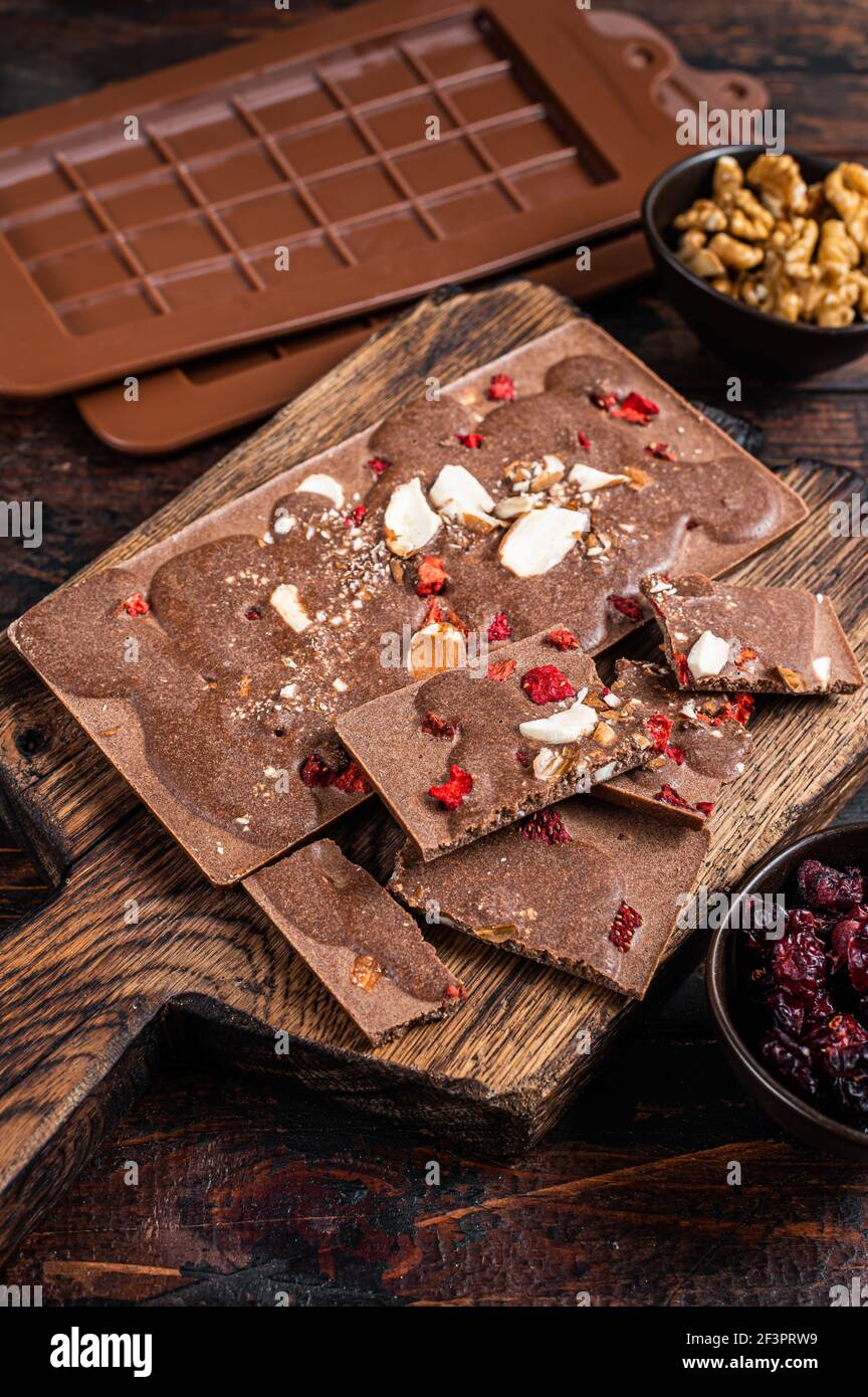 Homemade Craft milk chocolate bar with hazelnuts, peanuts, cranberries ...