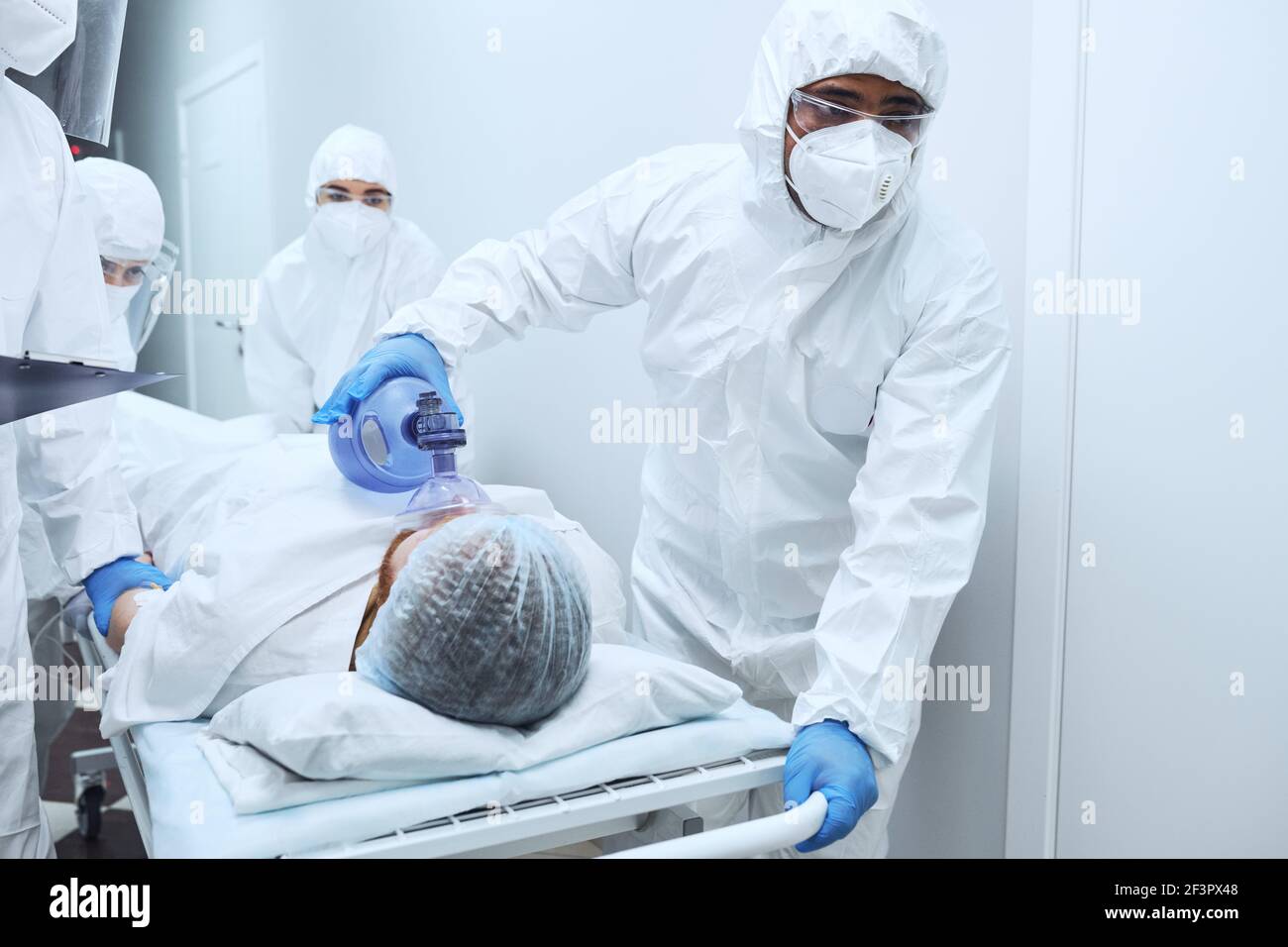 Doctors give resuscitation to a male patient in the emergency room ...