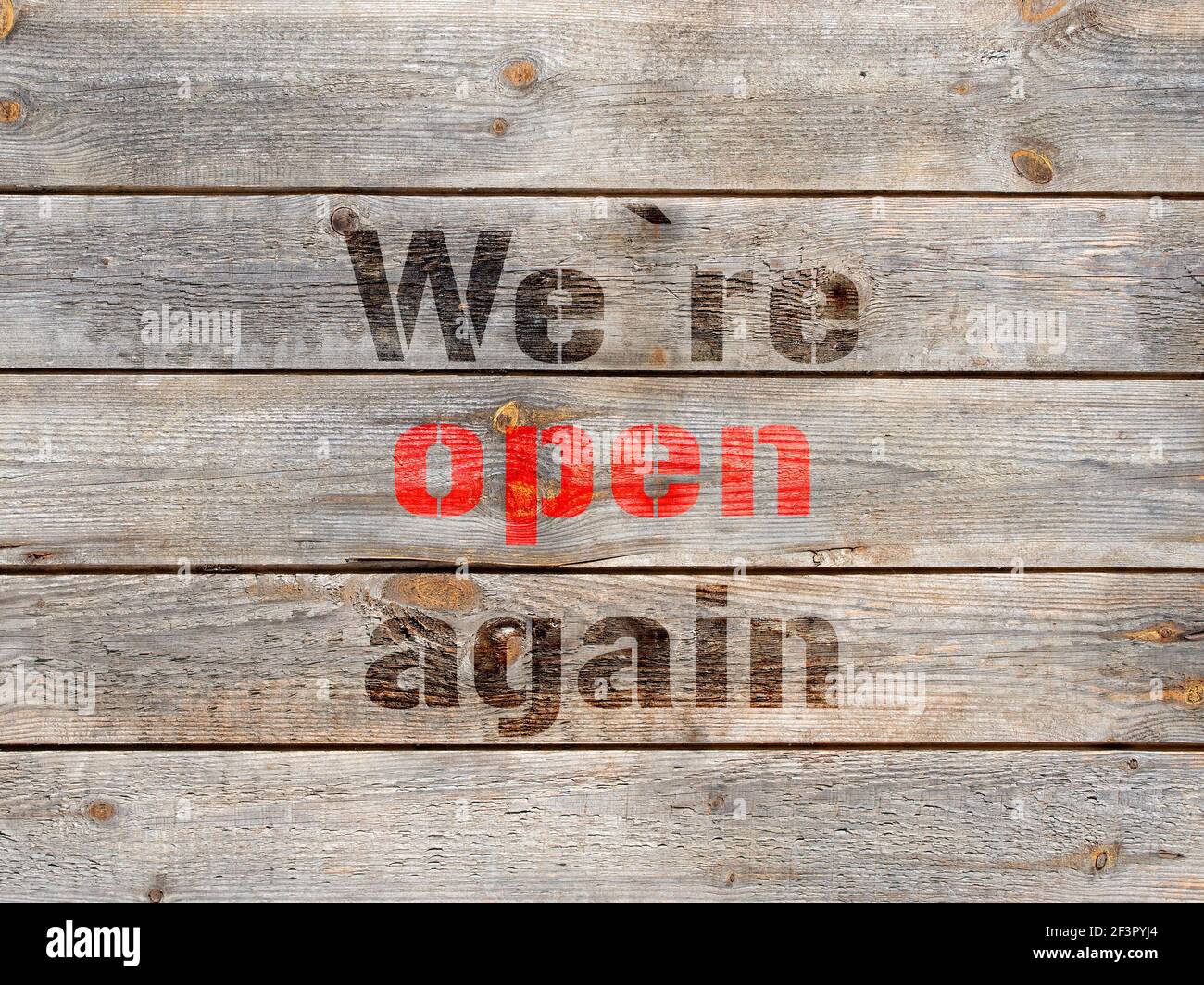 Wooden wall with the imprint "We`re open again Stock Photo - Alamy