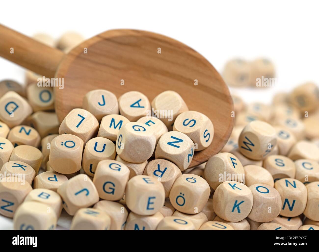 Wooden cubes with letters and wooden spoon Stock Photo - Alamy