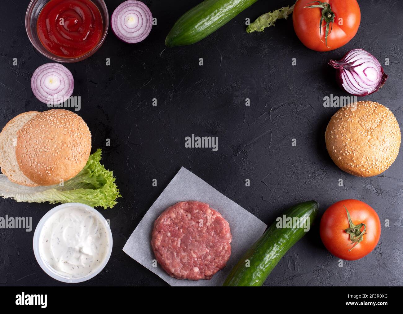 Beef burger ingredients: patties, onion, lettuce, tomato, cucumber ...