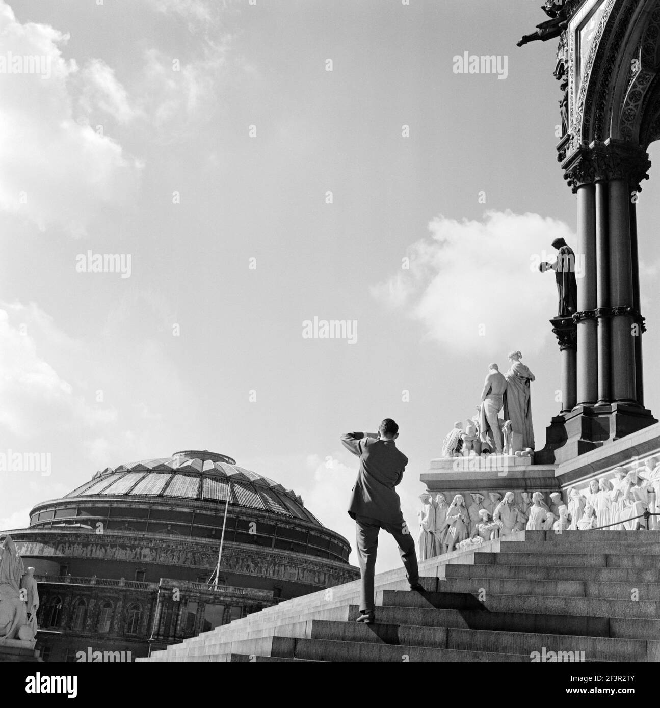 A photographer stands on the steps of the Albert Memorial while ...