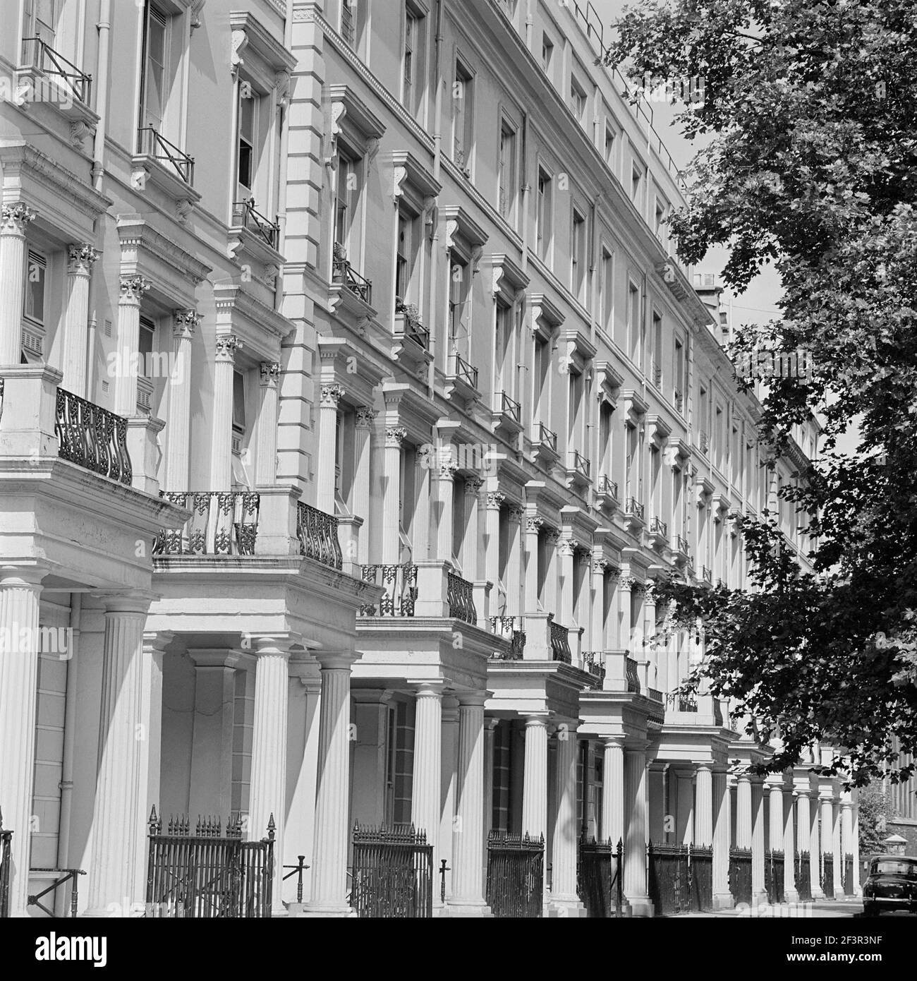 A terrace of four-storey houses decorated in the neo-classical style ...