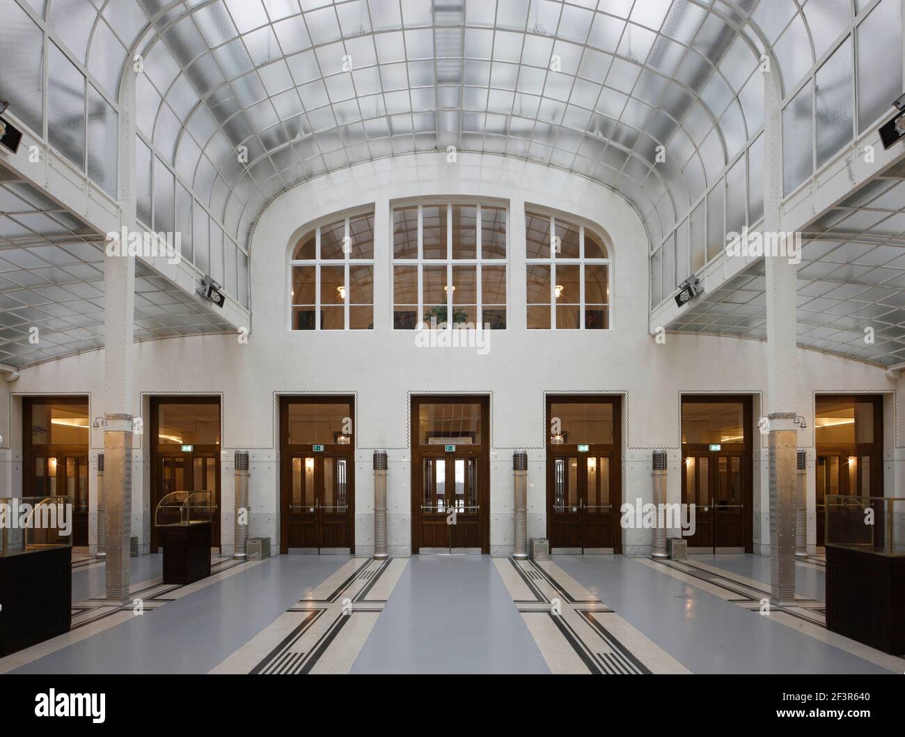 Glass roof marble floors wooden doors, Interior of postal savings bank ...