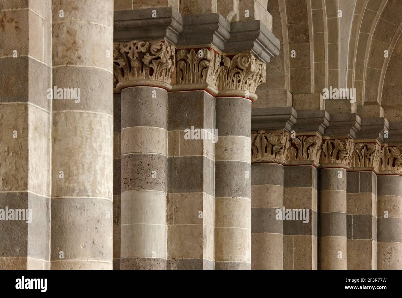 Stone pillars with decorative detail in St. Andreas Church, Cologne ...
