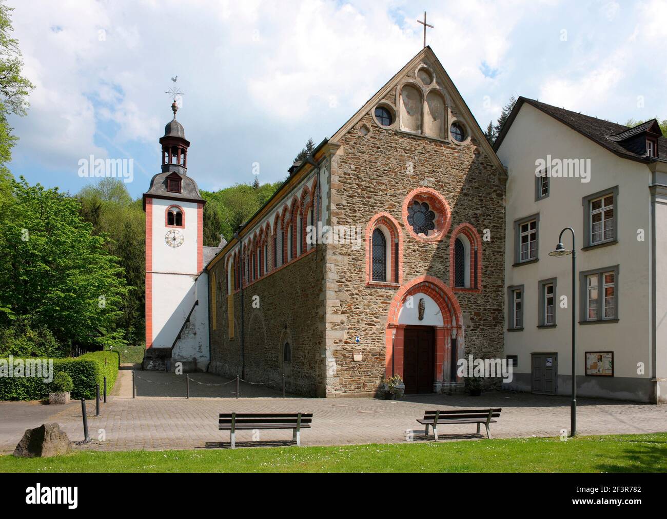 Benches face the Abbey of Sayn in village of Sayn, Bendorf, Germany ...