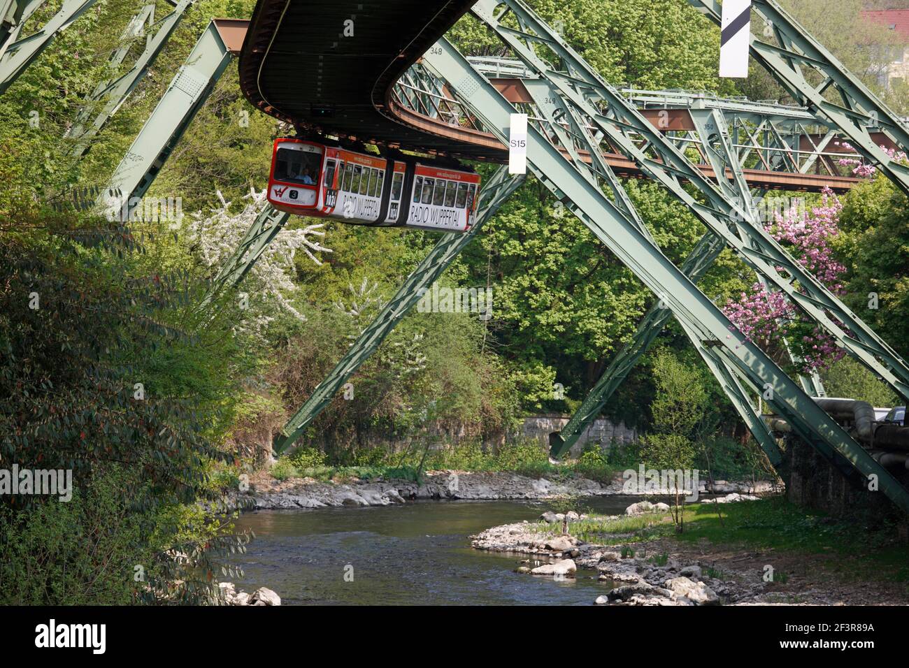 Wuppertal Schwebebahn, or Wuppertal Floating Tram, travelling above a ...