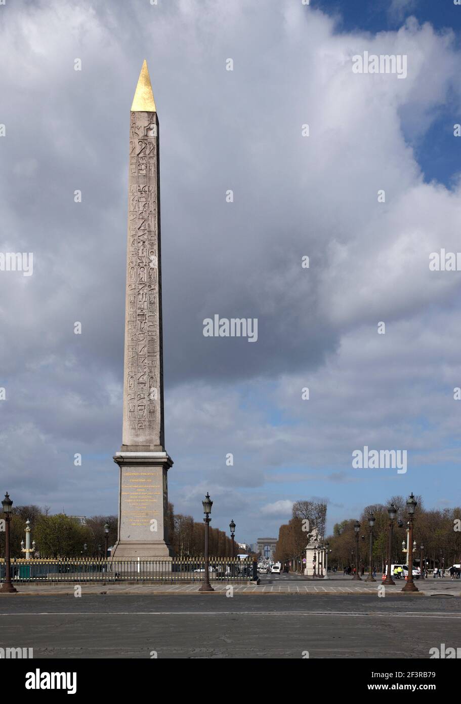 Egyptian obelisk with the triumphal arch in the distance (Arc de ...