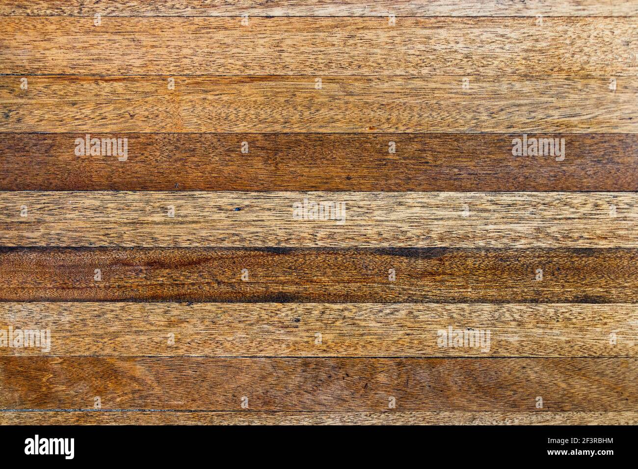 A golden-brown wooden floor made from strips of reclaimed timber Stock ...