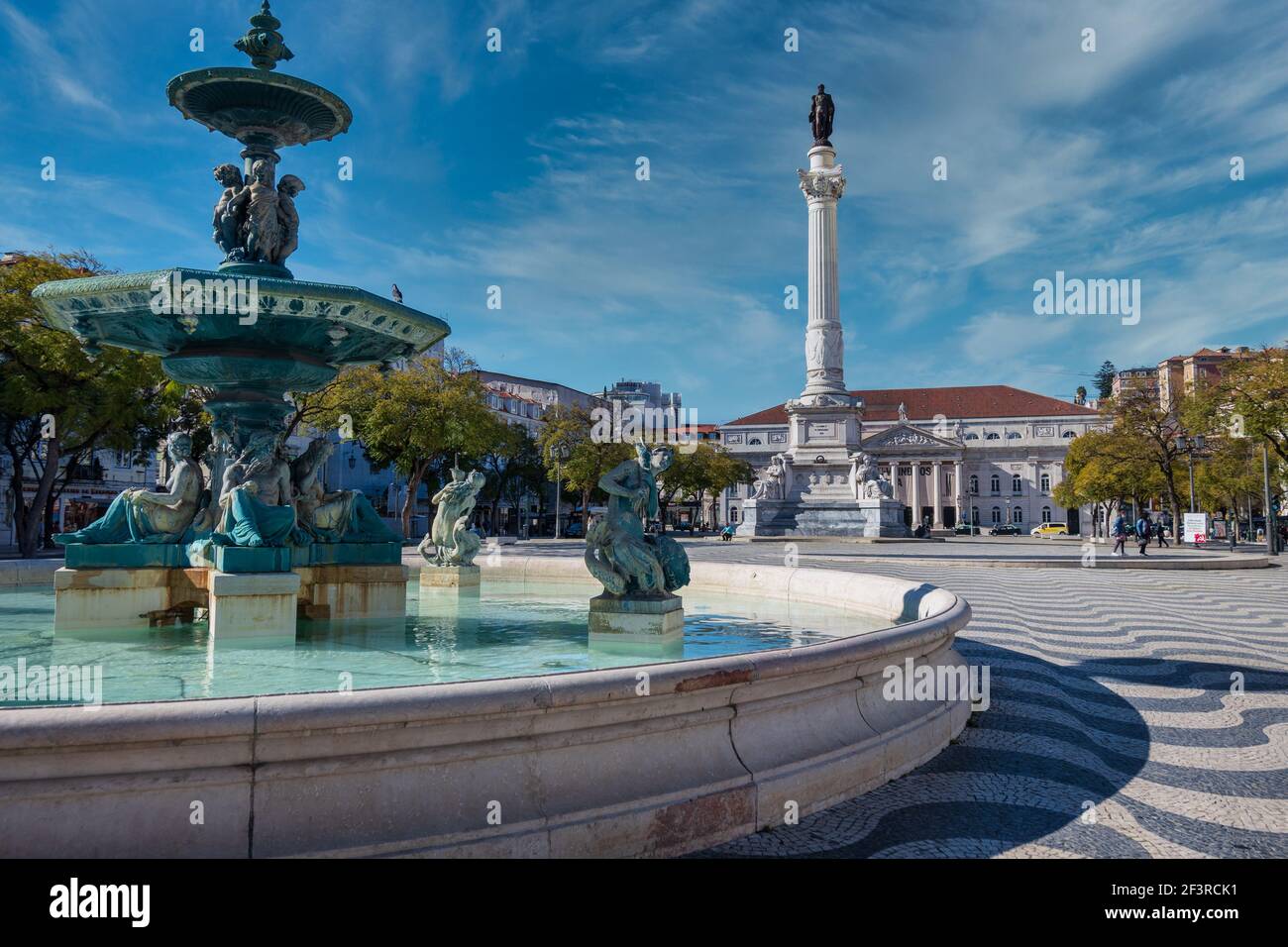 The iconic Rossio Square in Lisbon, Portugal, featuring the beautiful ...