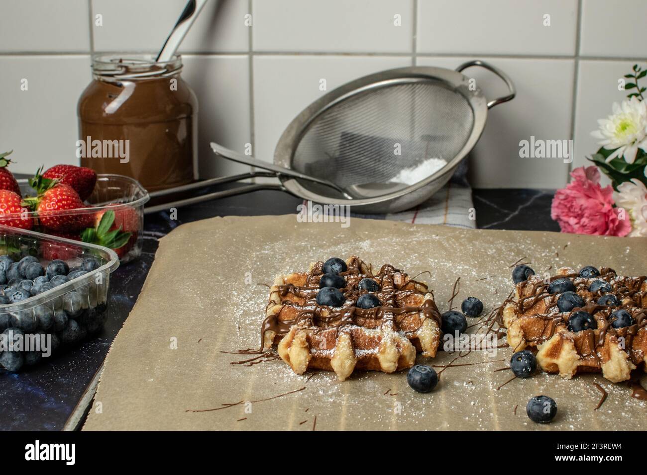 Yummy Belgian waffles with chocolate cream and blueberries on the ...