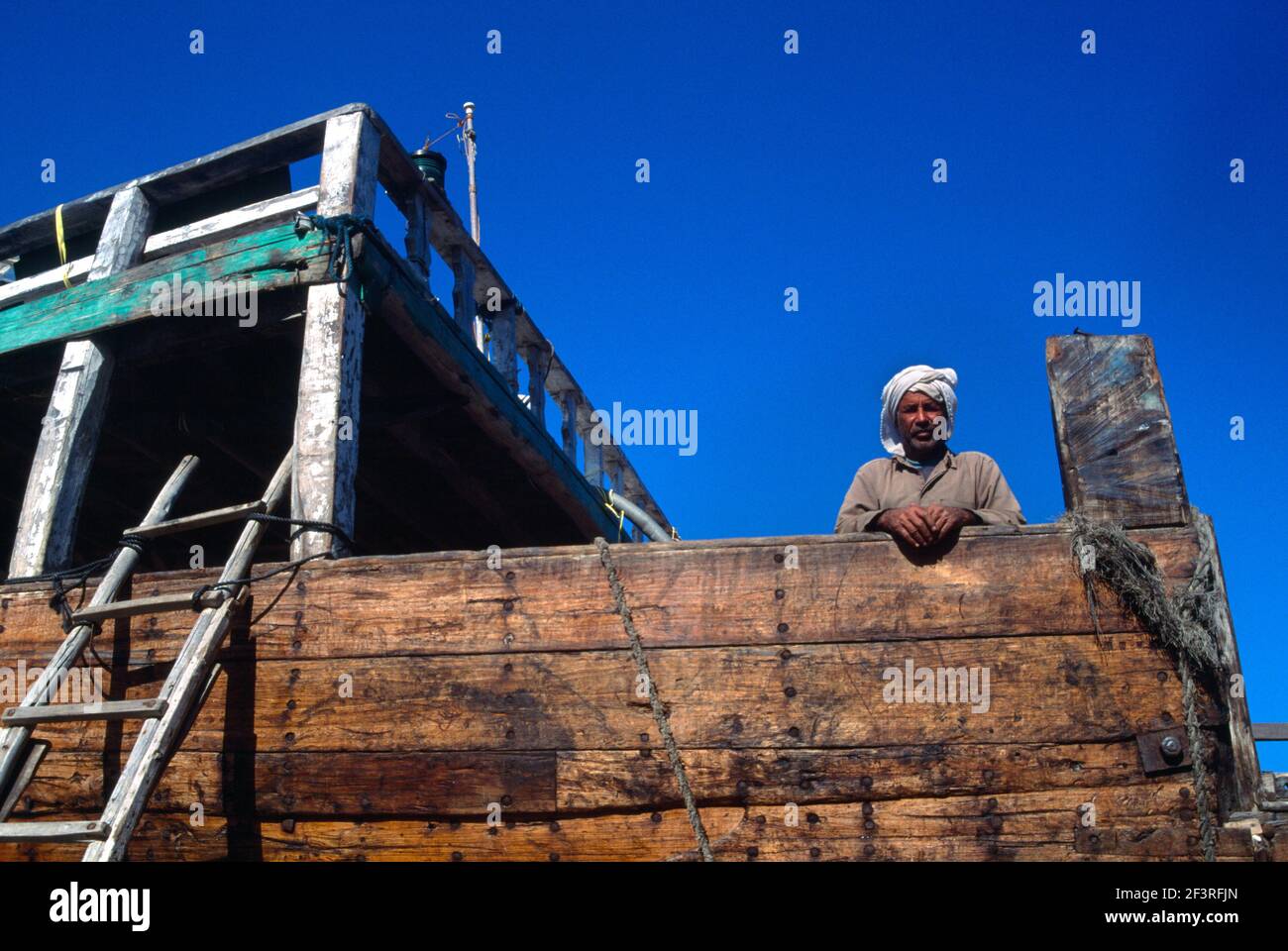 Sharjah UAE Man on Dhow Stock Photo - Alamy