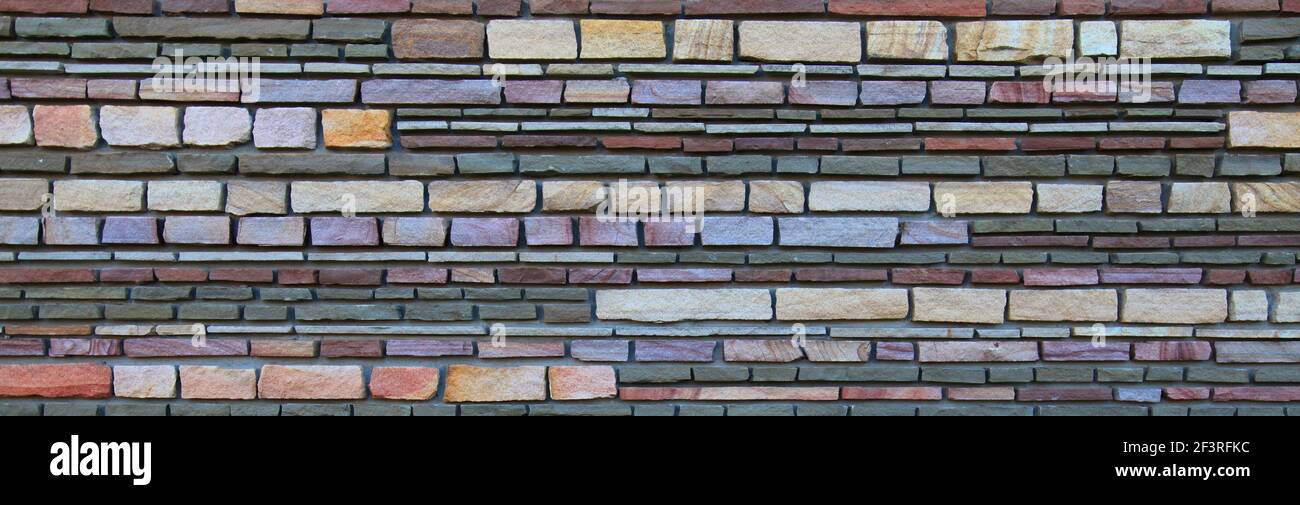 Surface and texture of multy-colored (colorful) decorative stone wall ...