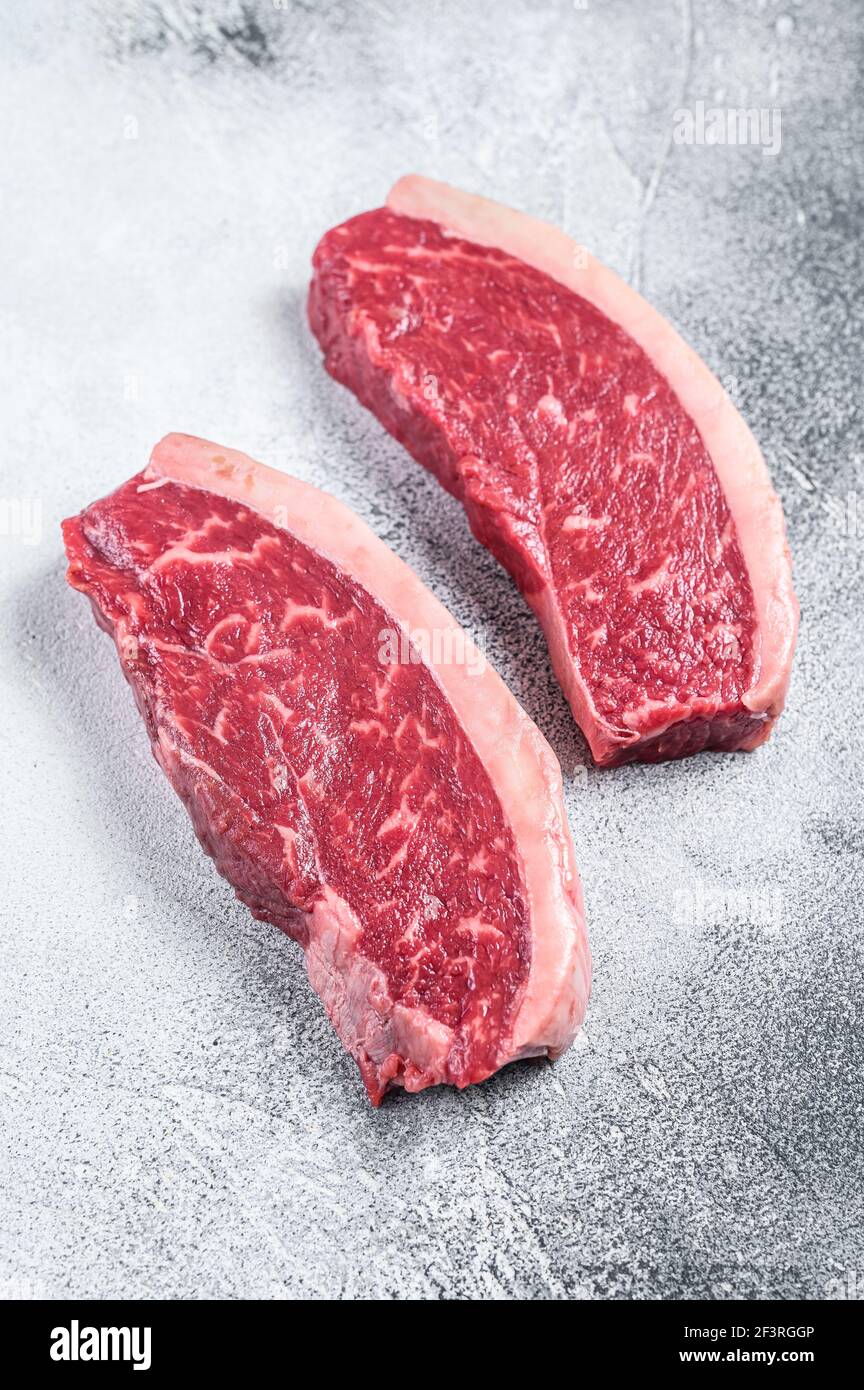 Raw cap rump or top sirloin beef meat steak. White background. Top view ...