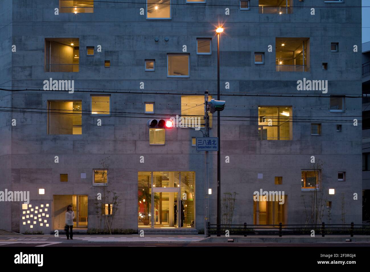 Grotto, Office and Store, Close-up of the south façade in the evening ...