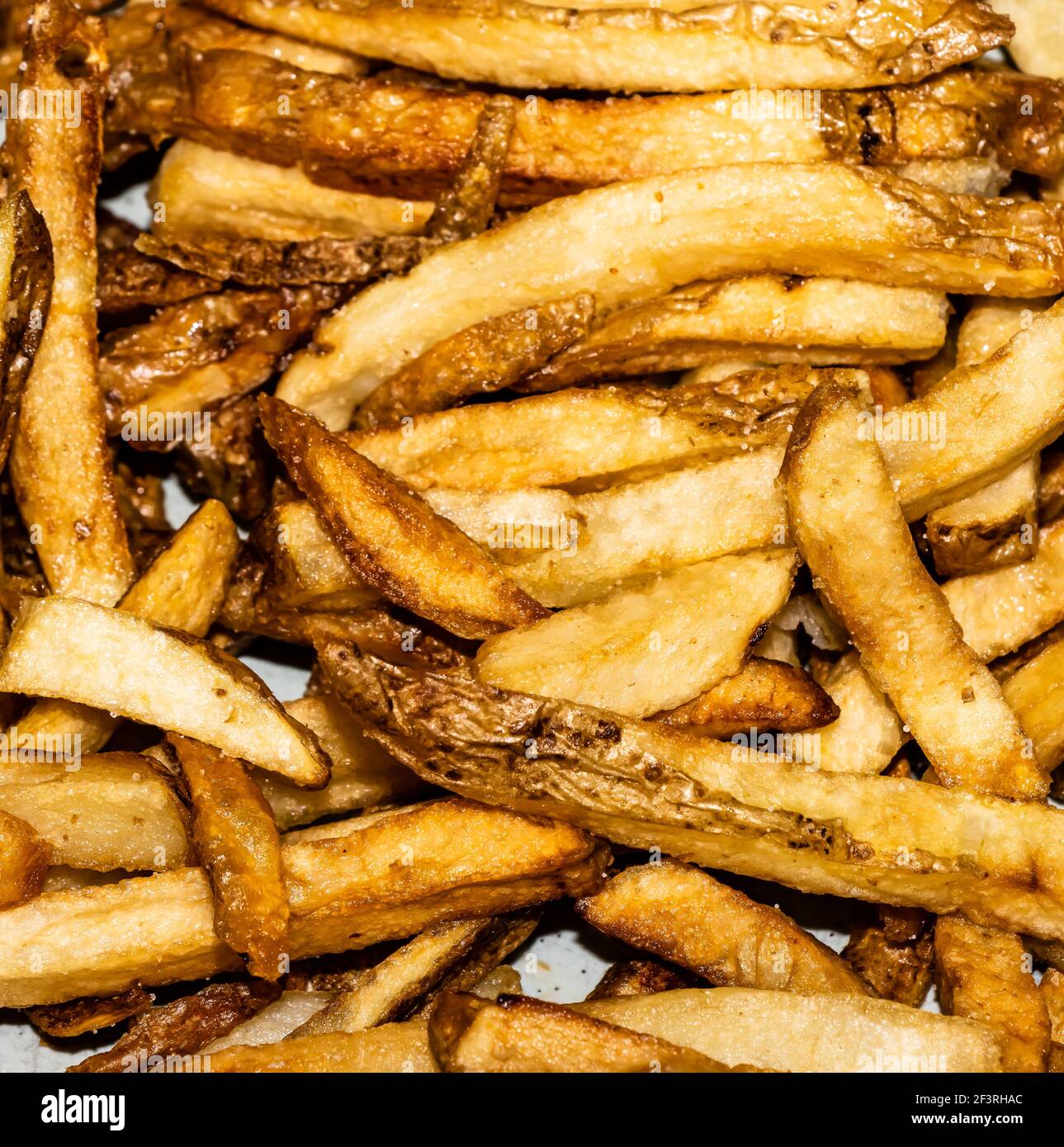 Close up image of greasy French fries from a fast food restaurant ...