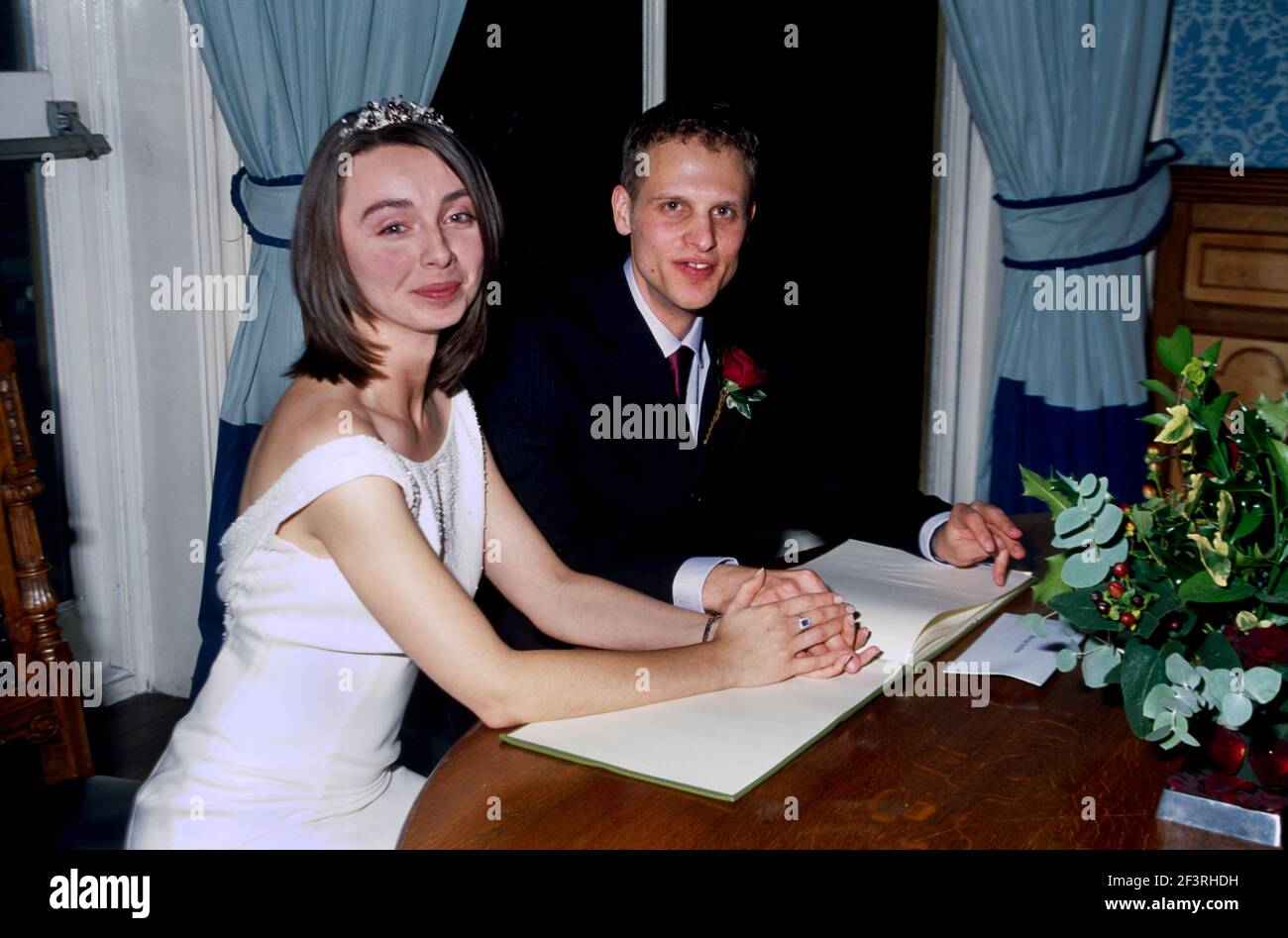 Bride & Groom Bride In Traditional White Dress Couple Signing Register ...