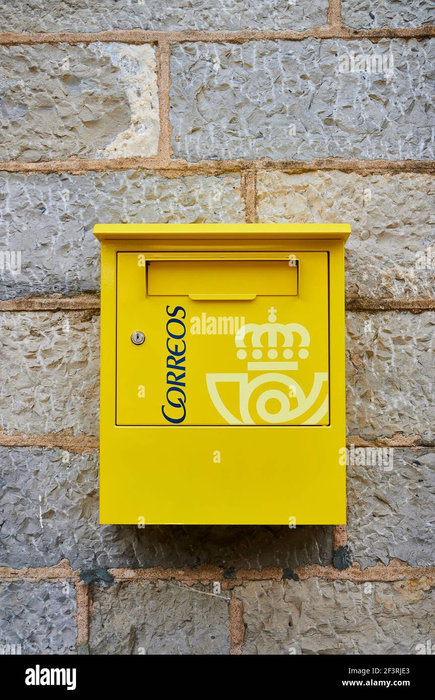 Yellow post box on wall hi-res stock photography and images - Alamy