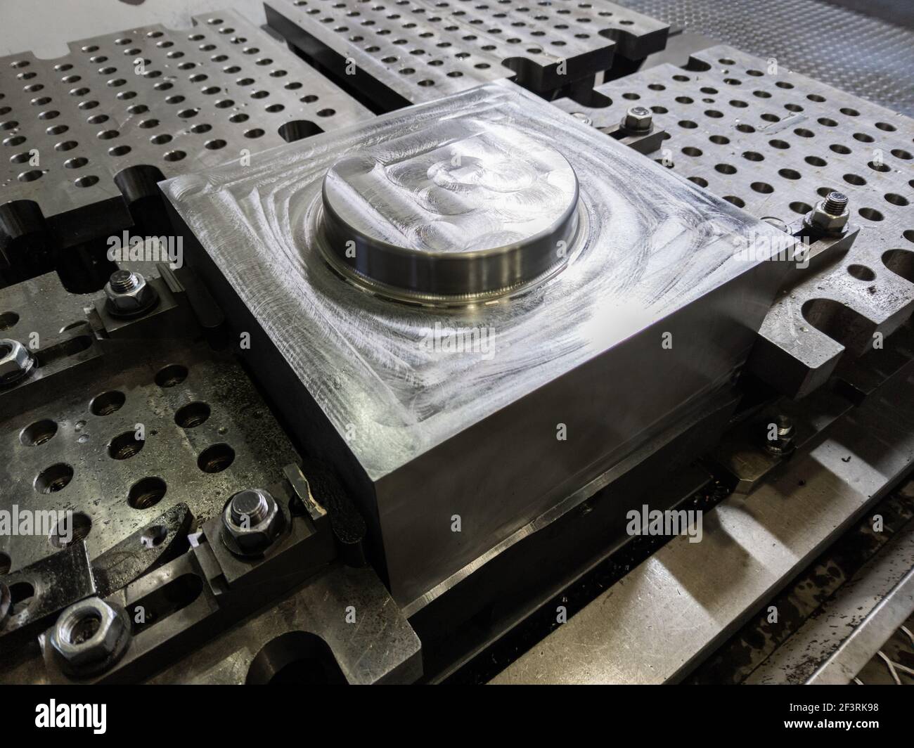 large steel workpiece after cnc surface milling on table of milling ...