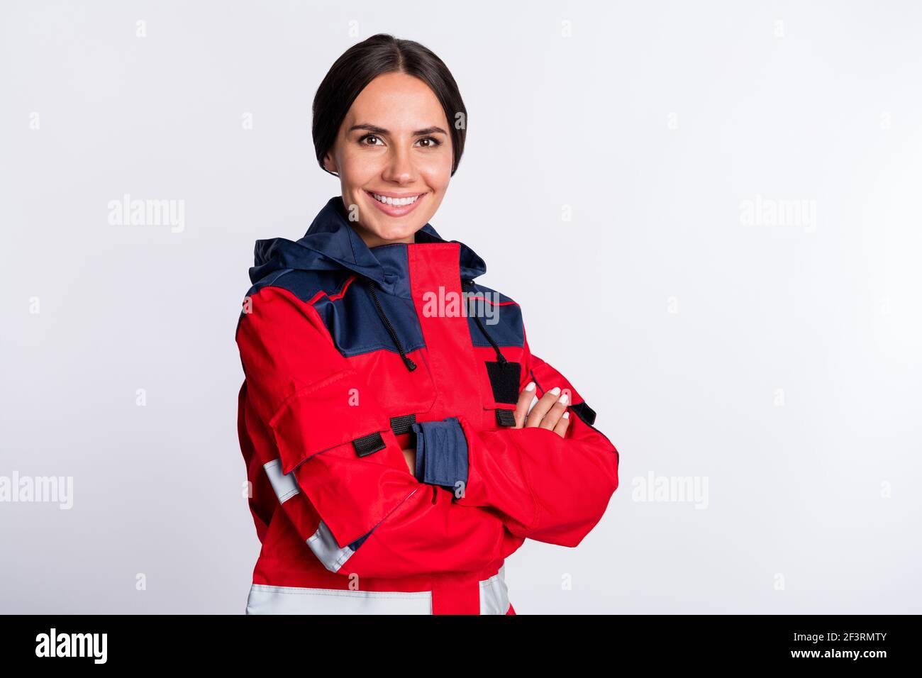 Photo of positive charming young lady paramedic dressed red uniform ...
