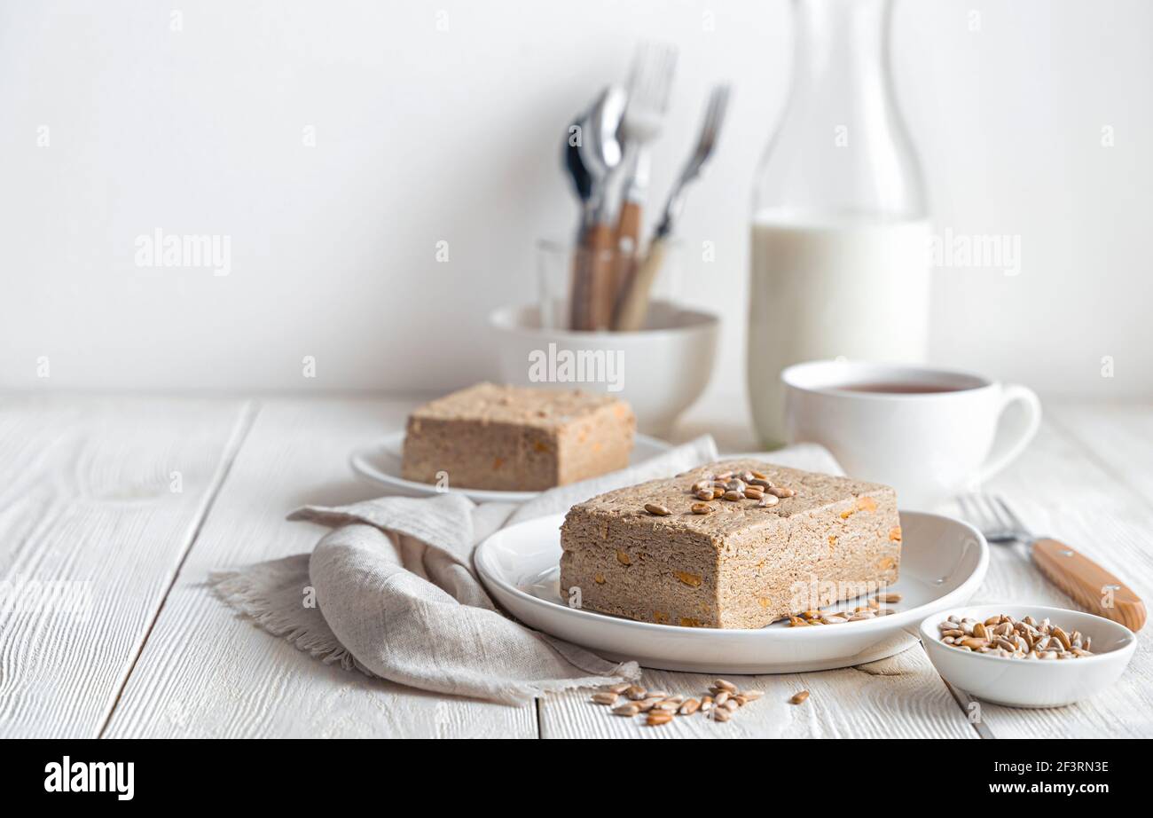 Halva dessert on a white background. Oriental sweetness. Side view with ...