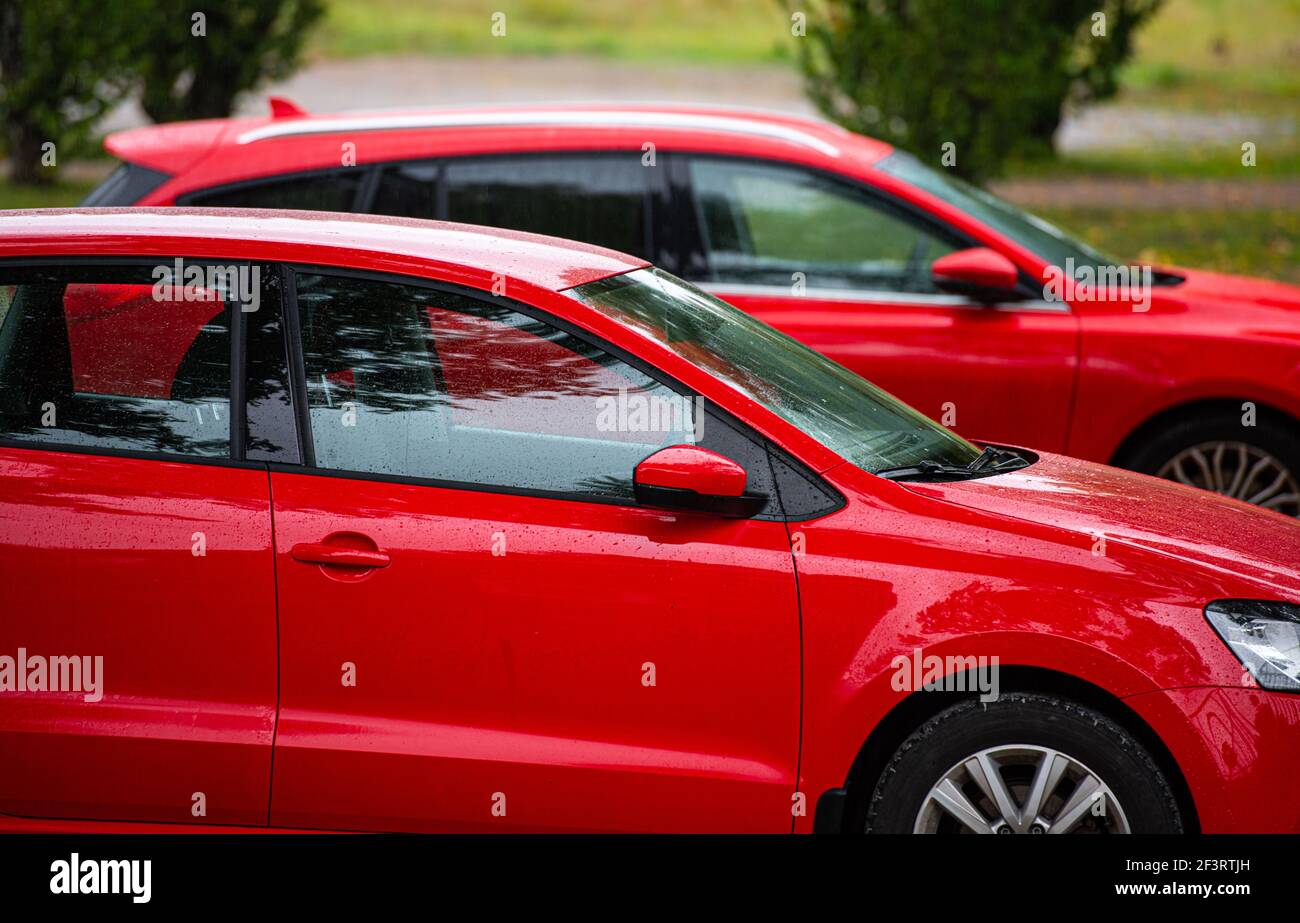 Details of two red cars Stock Photo - Alamy