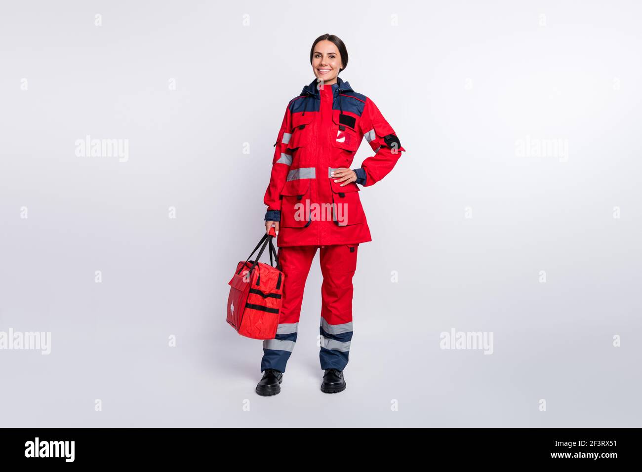 Full length body size view of attractive cheery girl doc rescuer ...