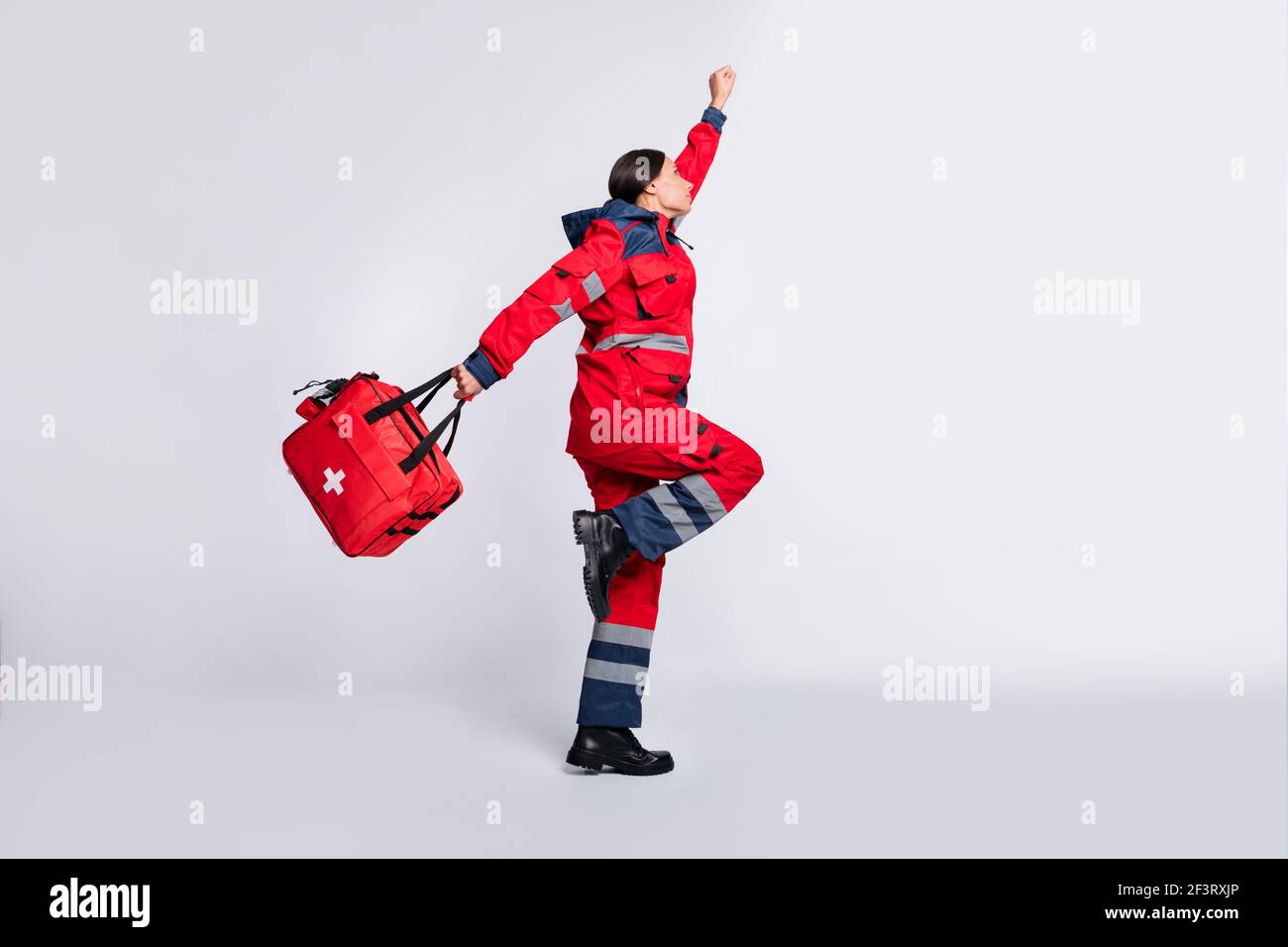 Full length body size profile side view of motivated girl doc rescuer ...