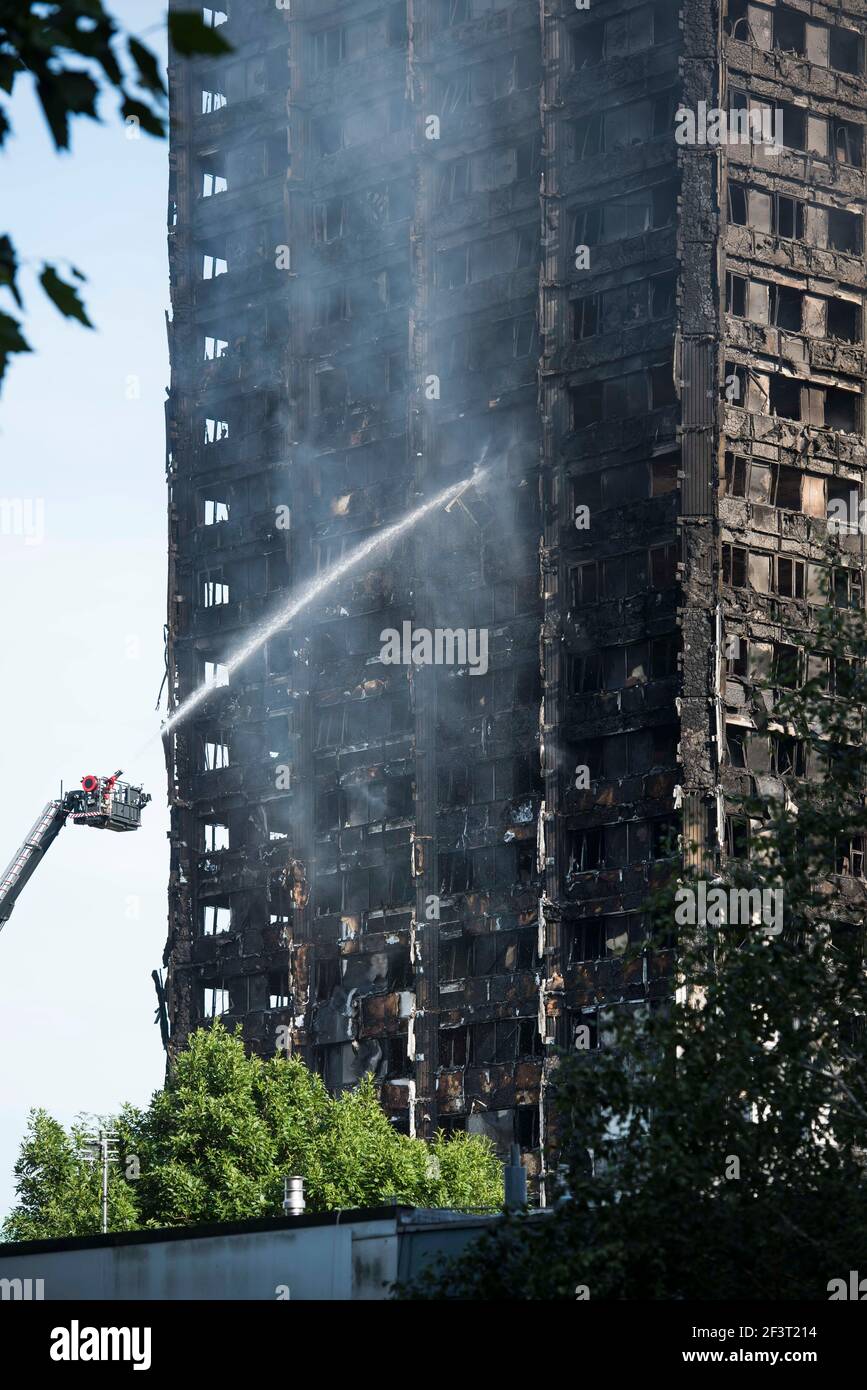London Fire Brigade hozes down Grenfell Tower in the aftermath of a ... London Fire Brigade hozes down Grenfell Tower in the aftermath of a ...