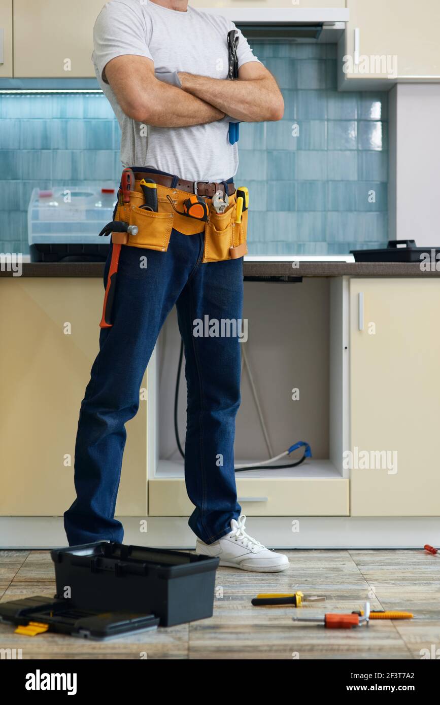 Fixing his belt hi-res stock photography and images - Alamy