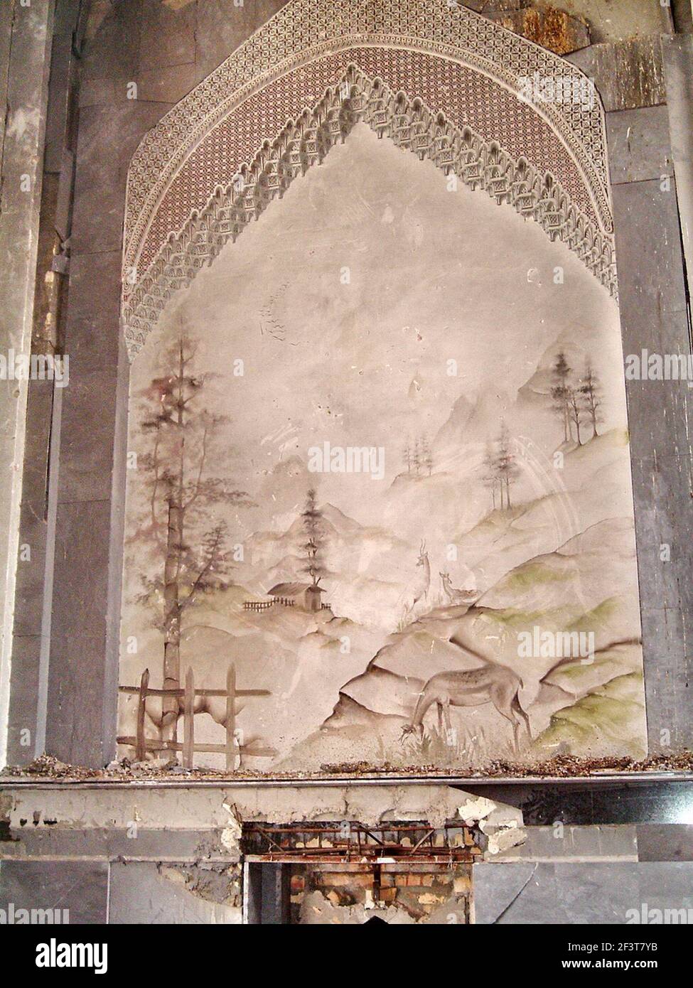 Mural above a mantel on a bomb damaged building on Camp Slayer, in ...