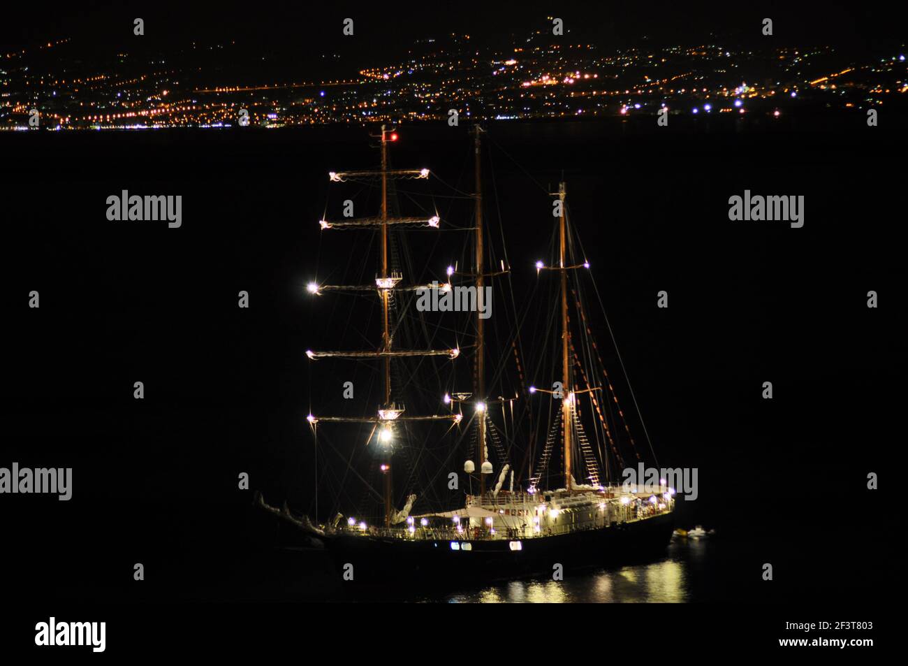 Sailing ship at night Stock Photo - Alamy