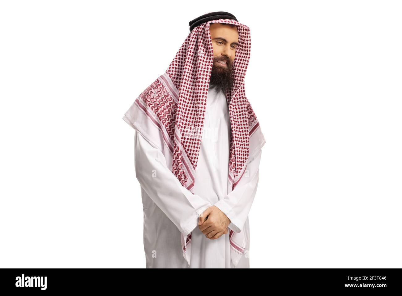 Young saudi arab man in a traditional dishdasha looking to the side ...