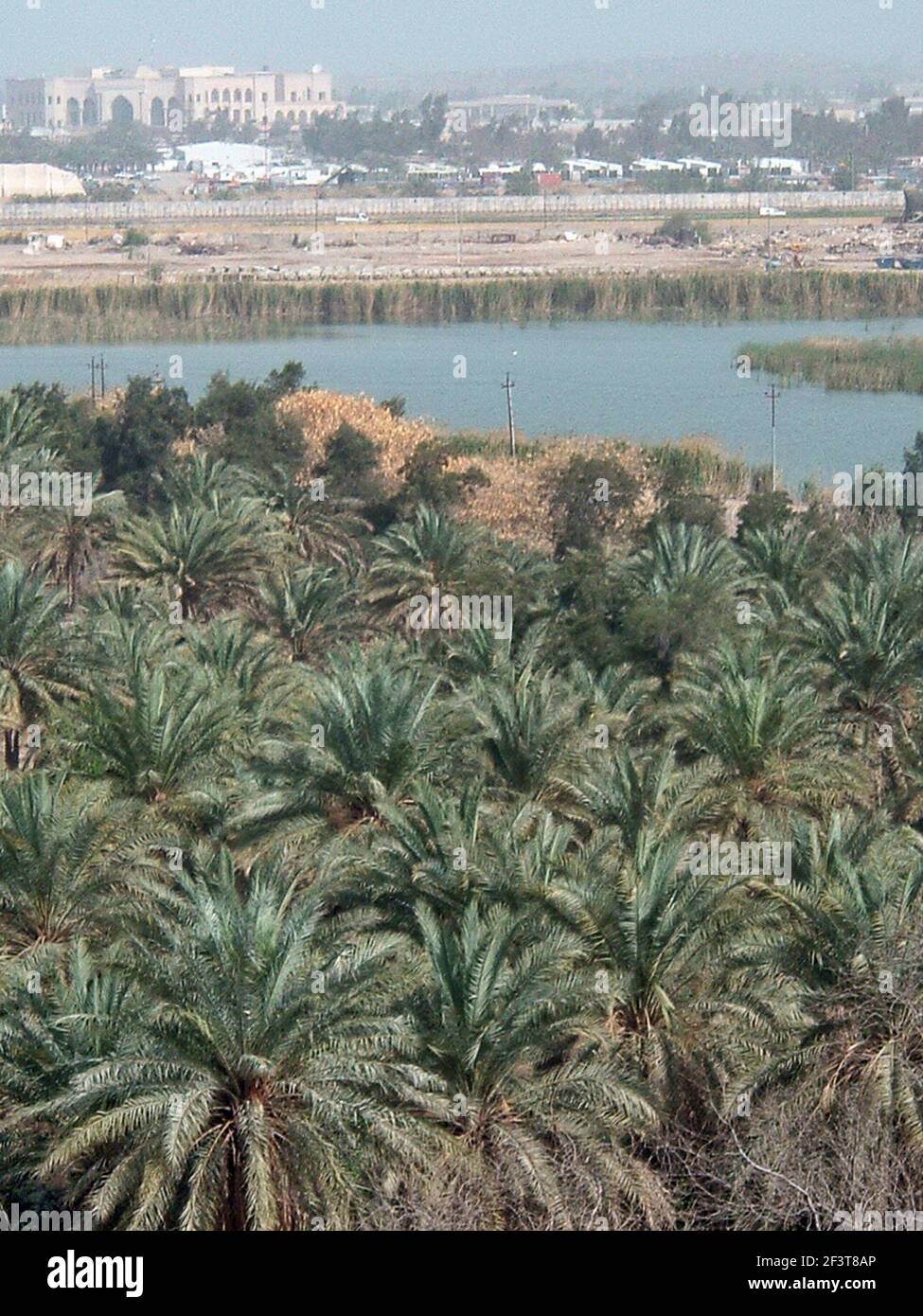 Overhead view of buildings around a lake in Baghdad, Iraq, during the ...