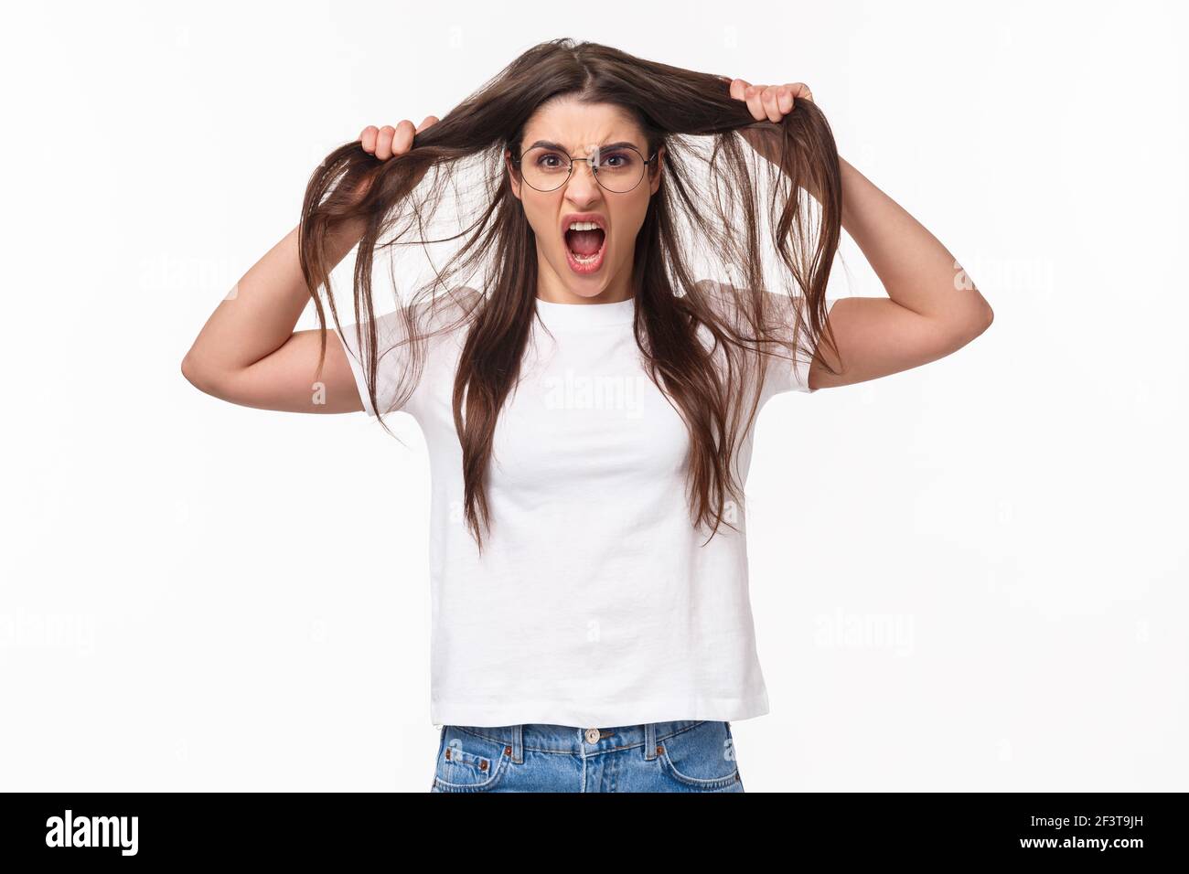 Waist-up portrait of bothered and annoyed, angry pissed-off young ...