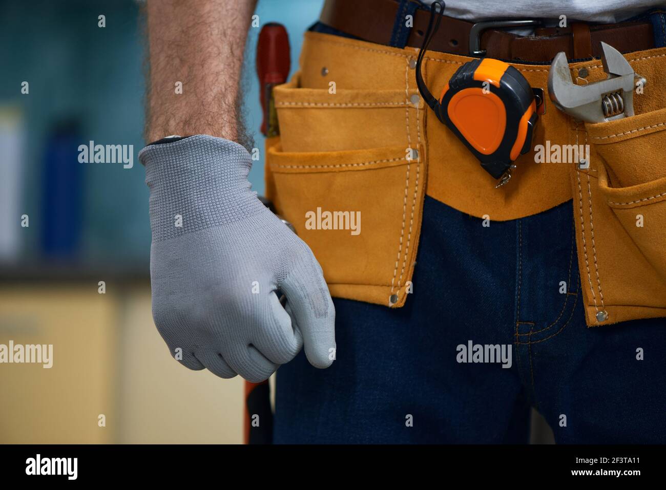 Close up of repairman wearing a tool belt with various tools Stock ...