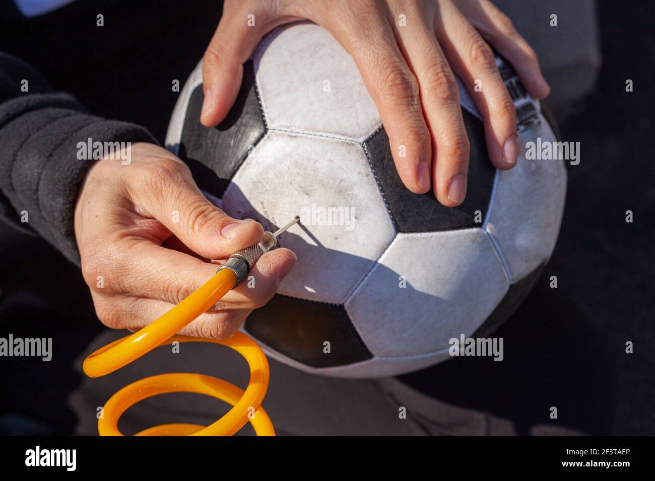 Close up image showing a caucasian woman holding a soccer ball and ...