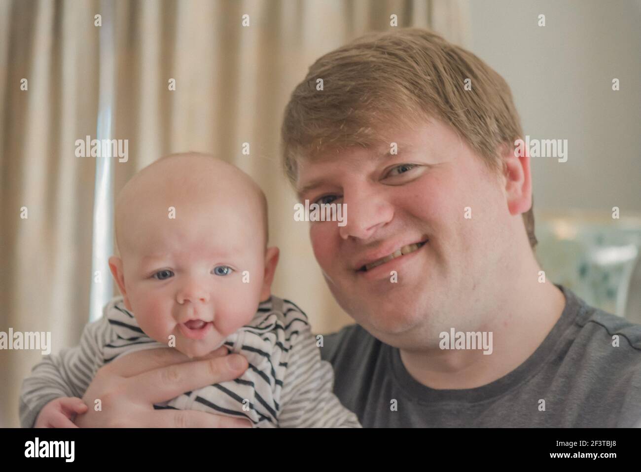 Baby with her father Stock Photo - Alamy