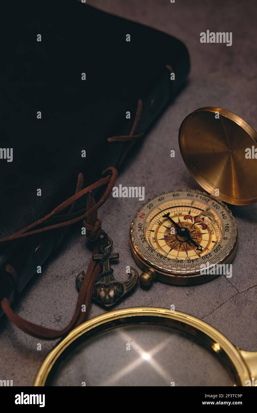 Old compass , magnifying glass hi-res stock photography and images - Alamy
