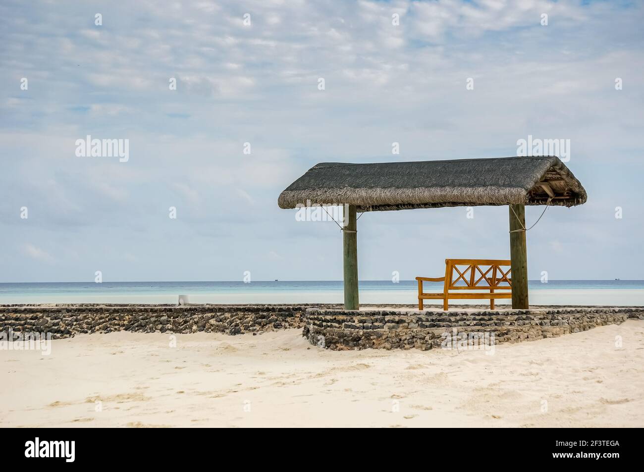 isolated bench on a tropical beach looking at the horizon Stock Photo ...