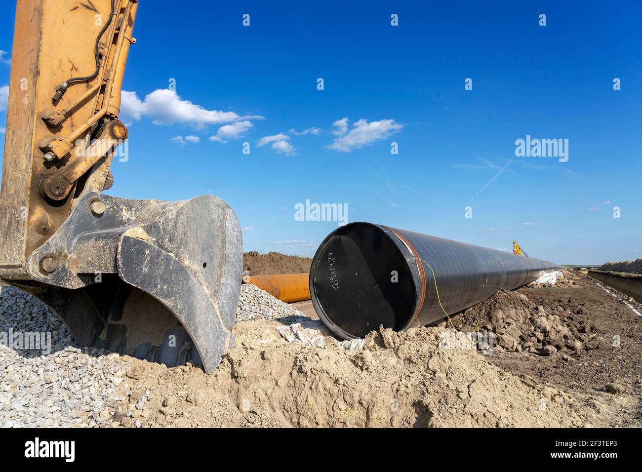 Heavy Machinery and Gas Pipeline Construction Site. Pipes are Laid on ...