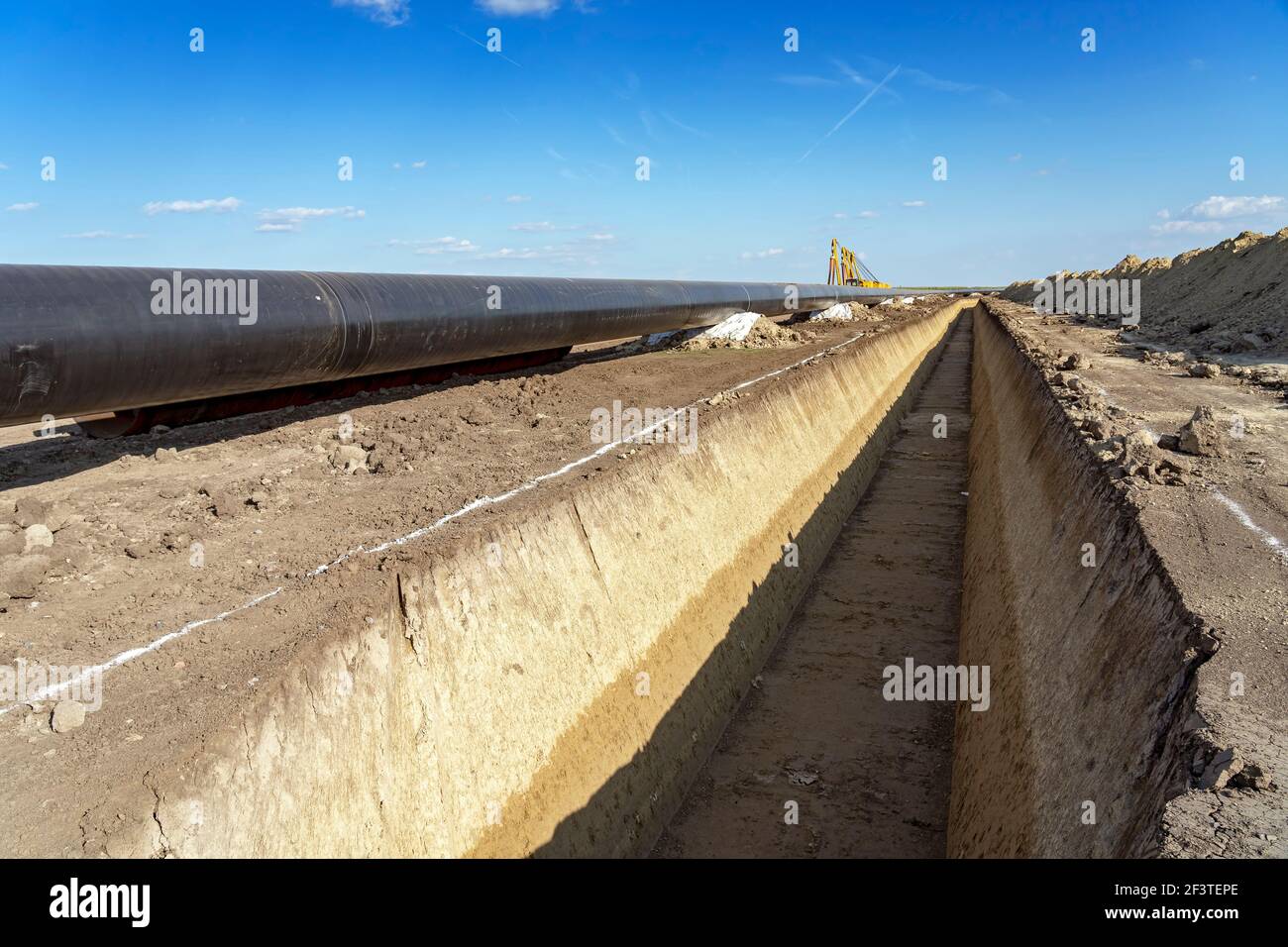 Heavy Machinery and Gas Pipeline Construction Site. Pipes are Laid on ...
