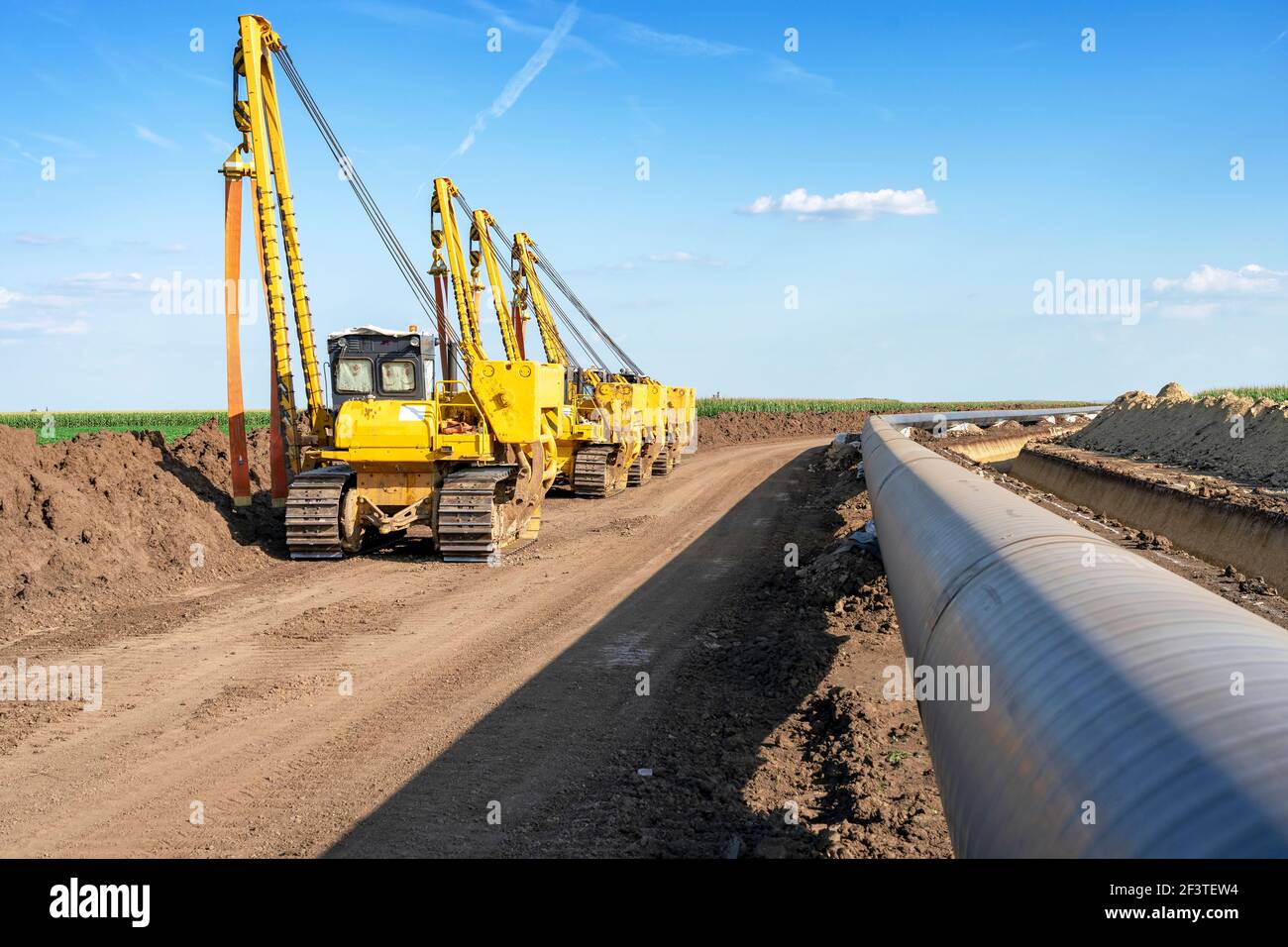 Pipes are Laid on Top of Supportive Sandbags Beside Trench and Welded ...